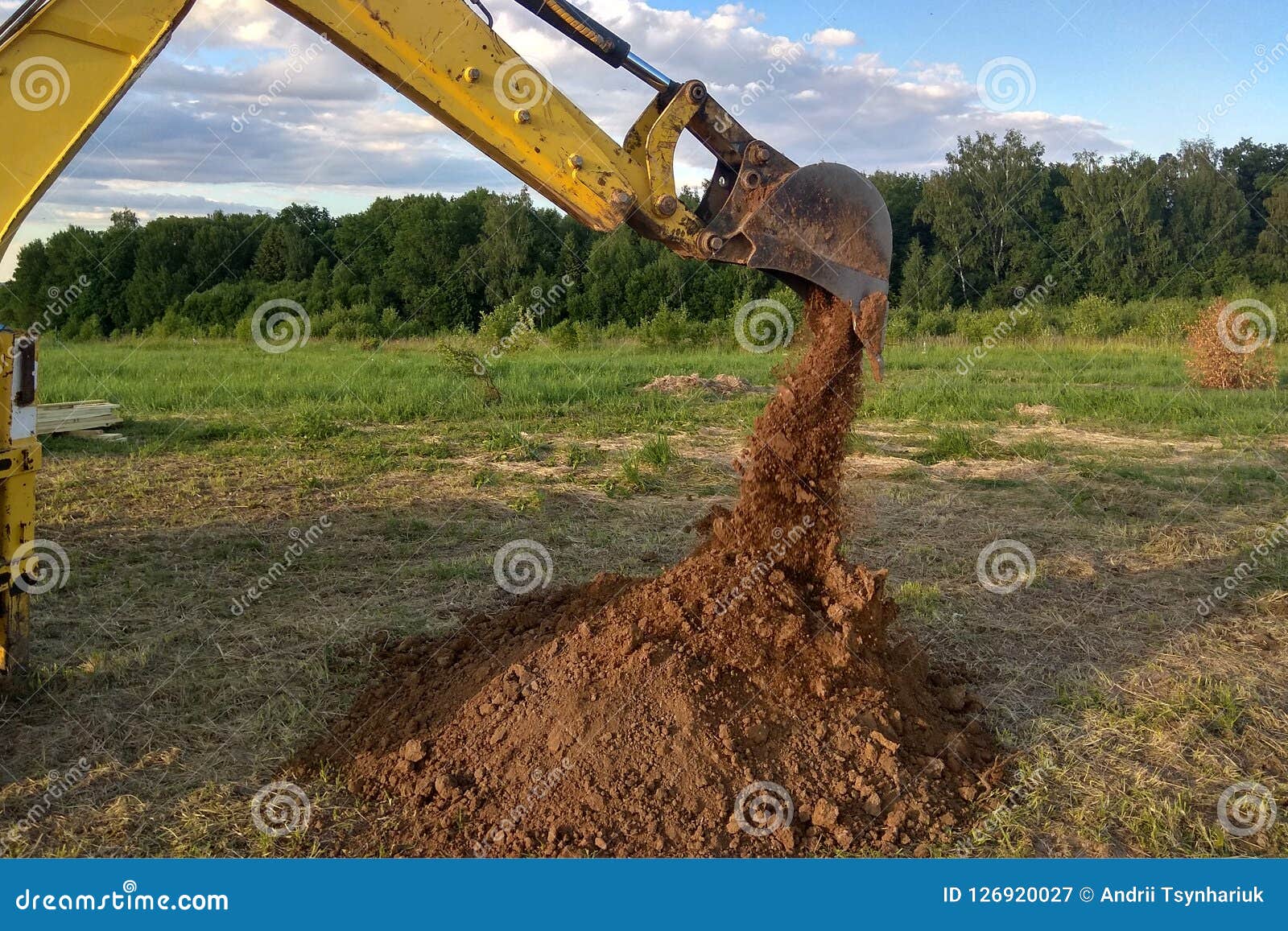 A Work Excavator Digging a Trench for the Foundation of a Building ...