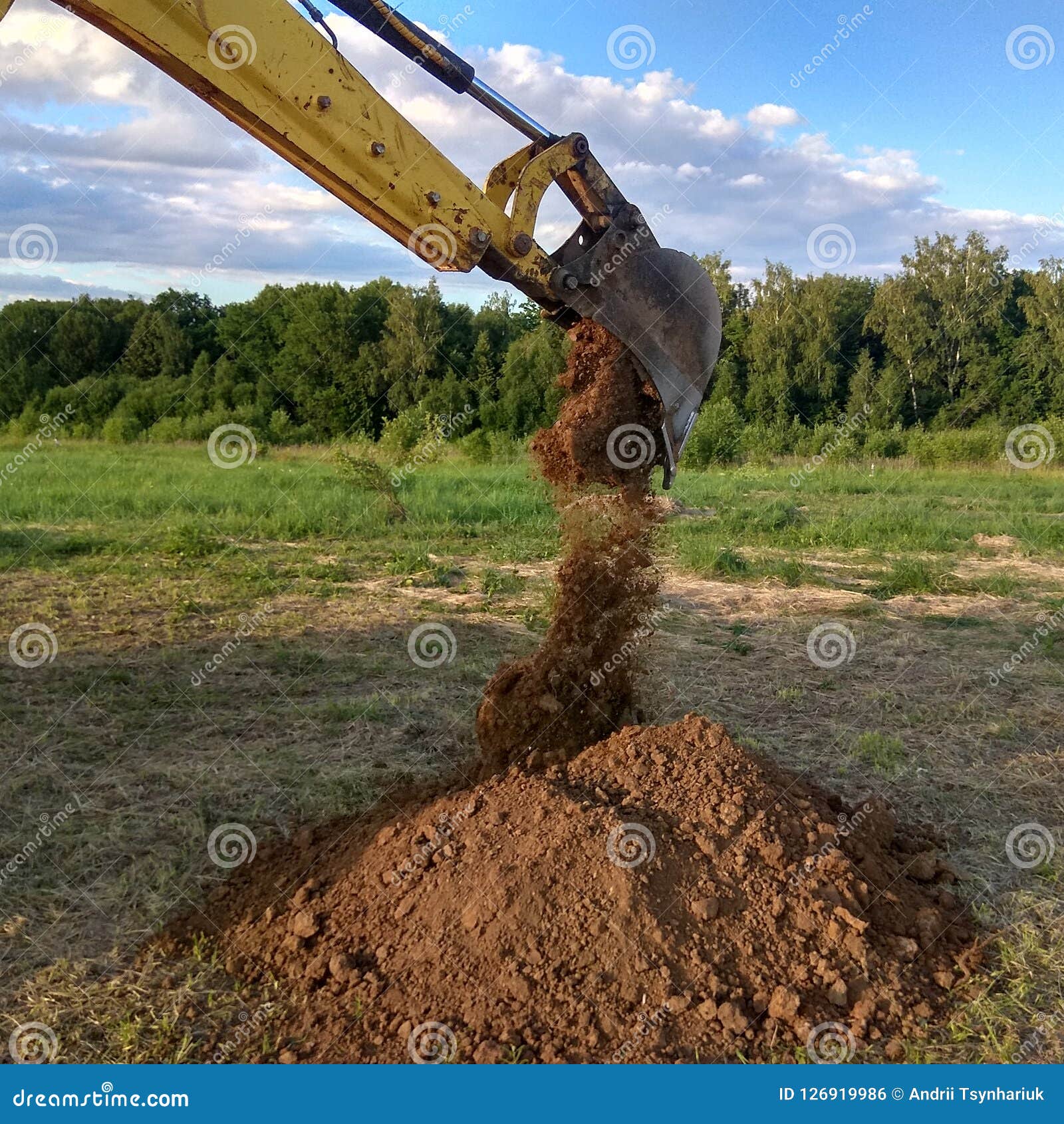 A Work Excavator Digging a Trench for the Foundation of a Building ...