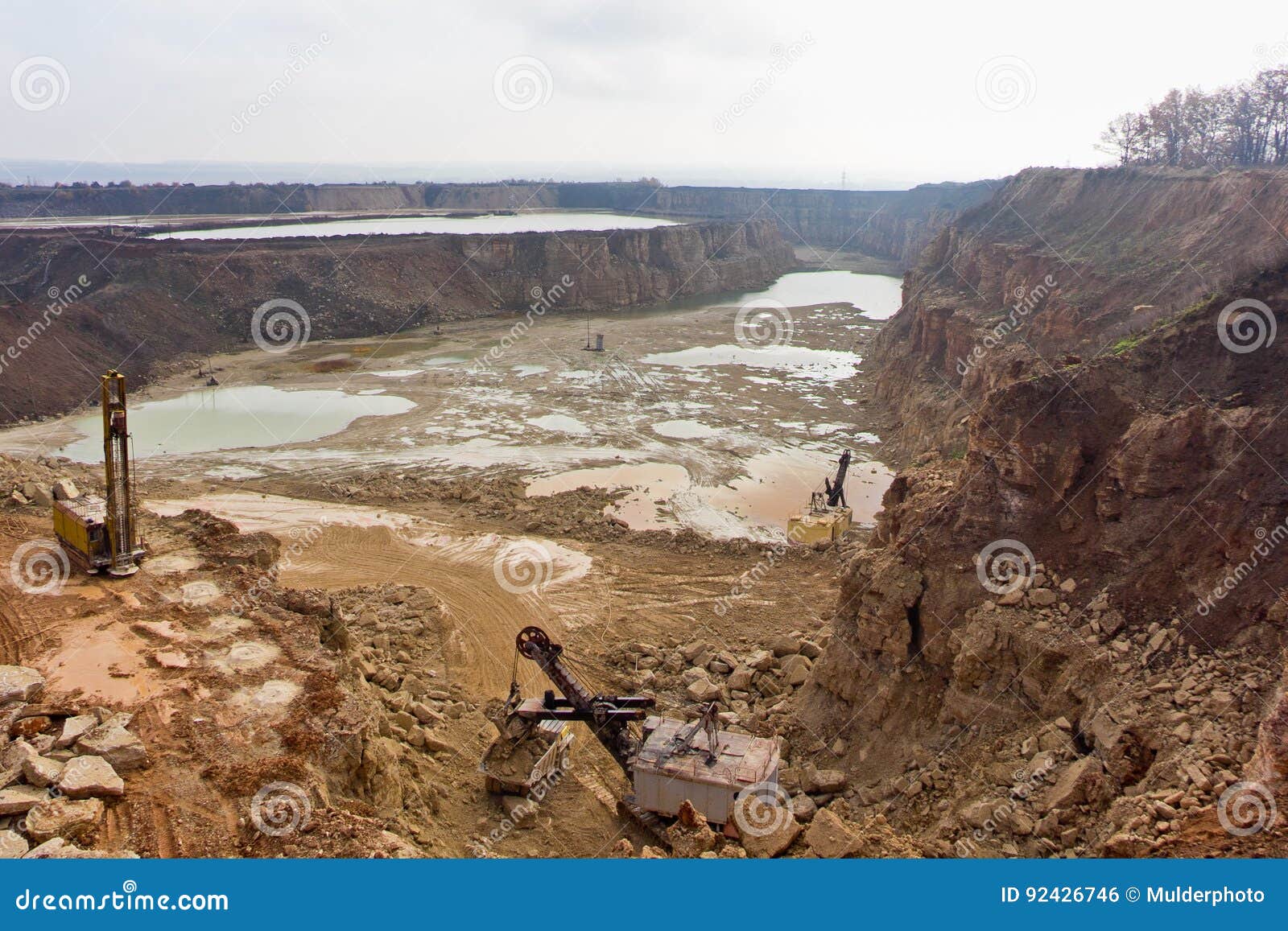 Work of Excavators on Limestone Mining in a Quarry Stock Photo - Image ...