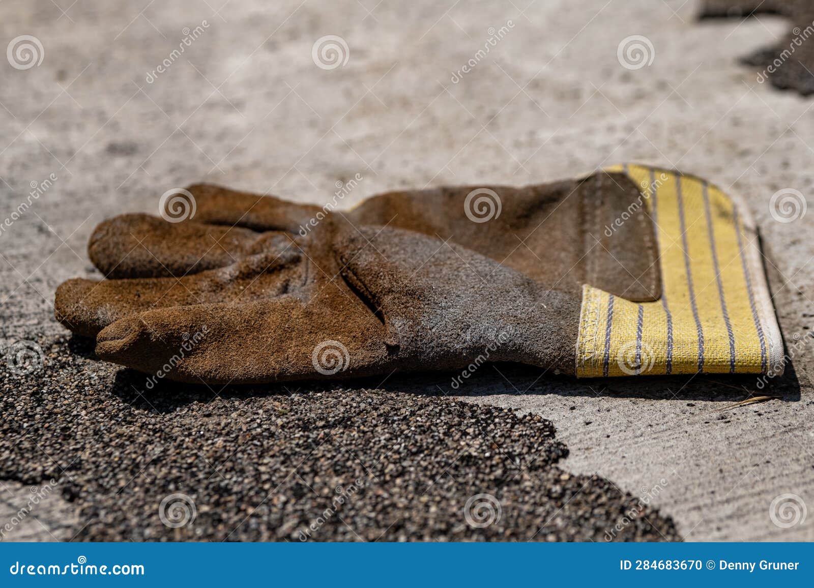 A work glove on a street stock photo. Image of work - 284683670