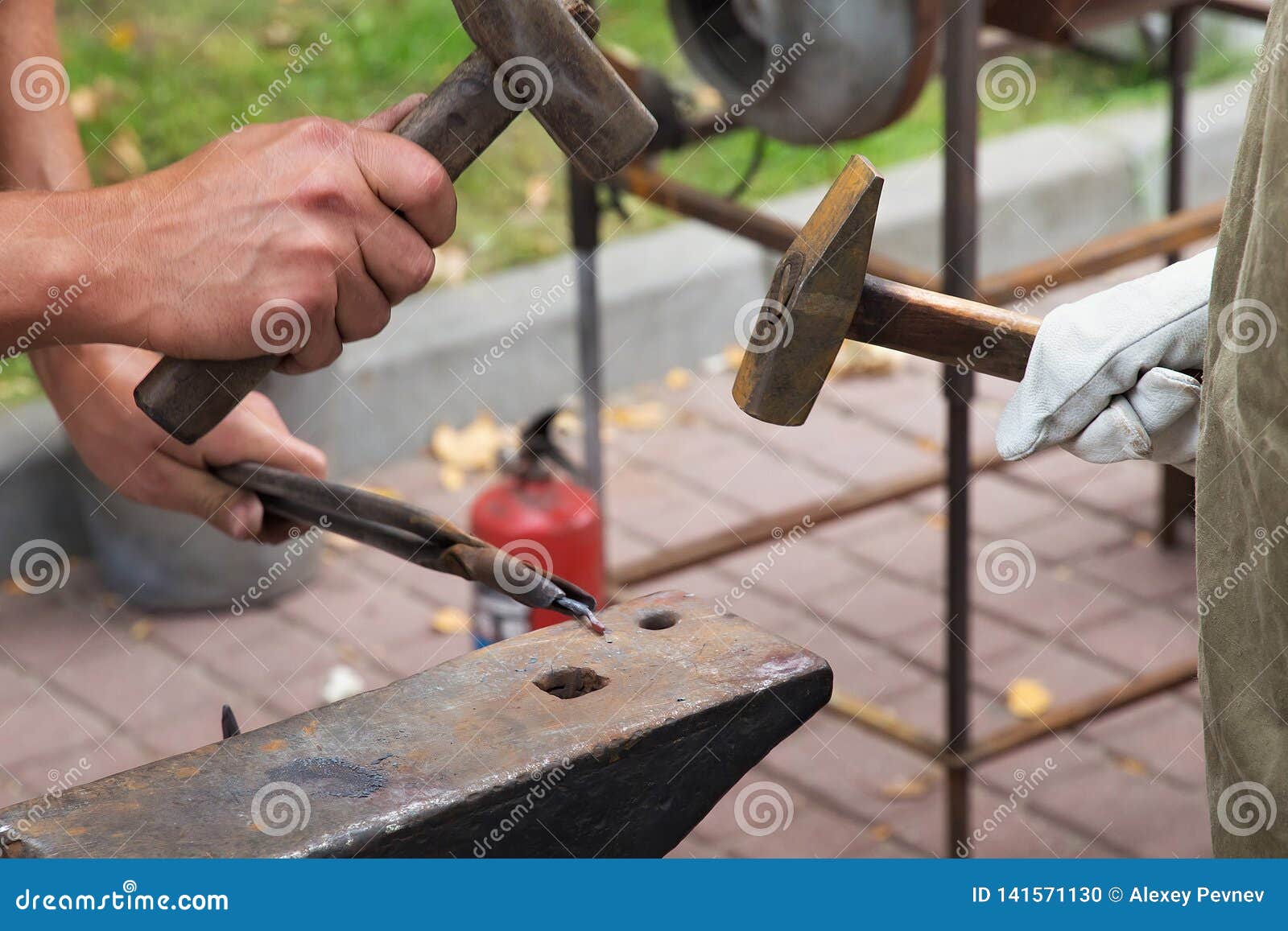 Work with Hammers on the Anvil in the Street Stock Photo - Image of ...