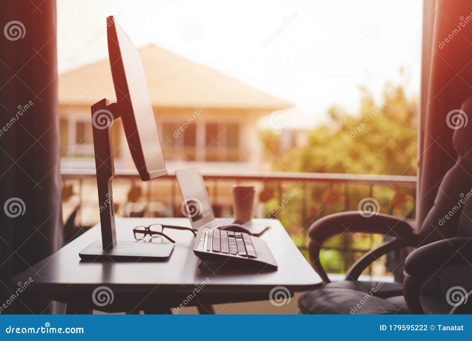 Working Table at Home with Computer Monitor and Laptop Computer Stock ...