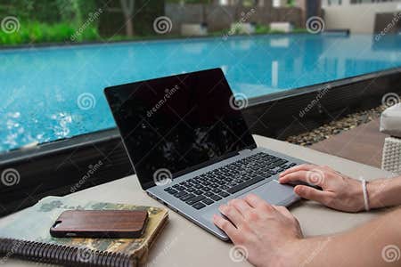 Work from home by the pool stock image. Image of outside - 92627775