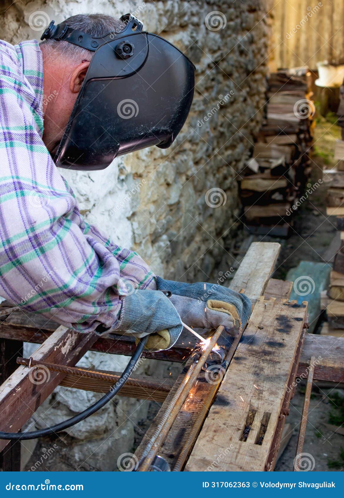 Work in the Industry. a Man Works with a Welding Machine Stock Image ...