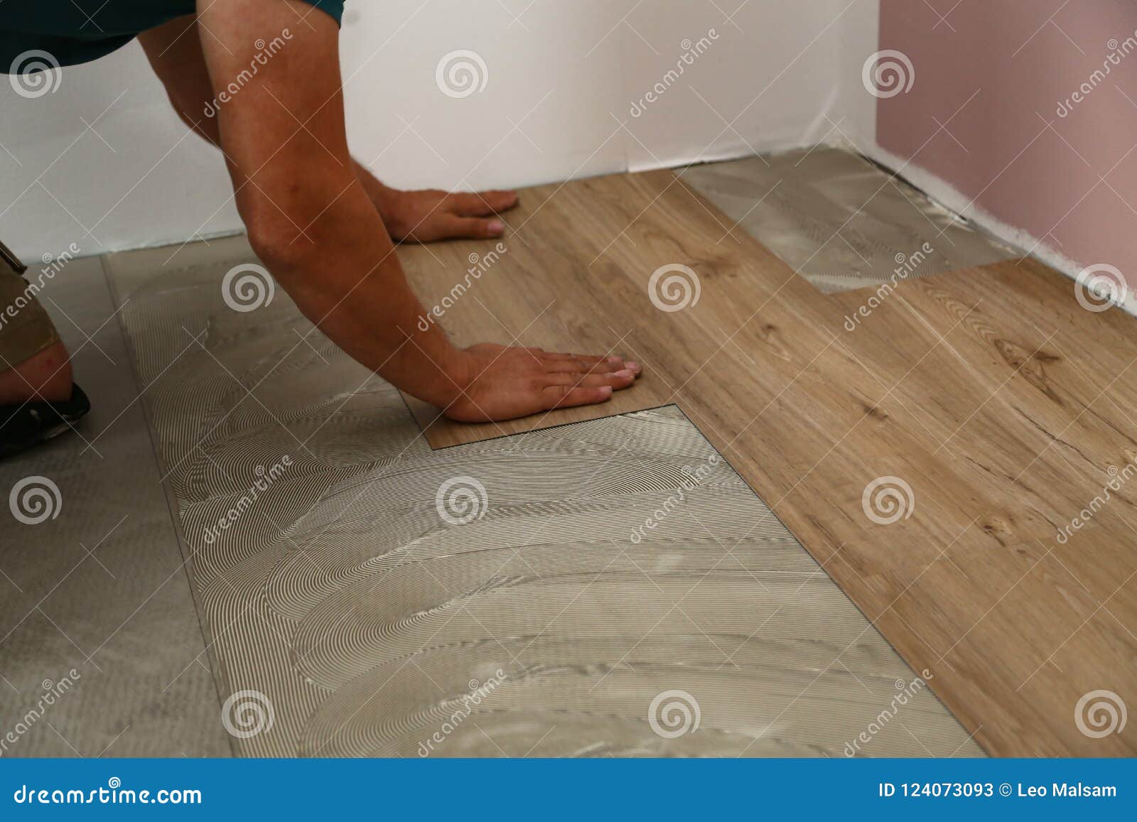 Work on laying flooring stock image. Image of construction - 124073093