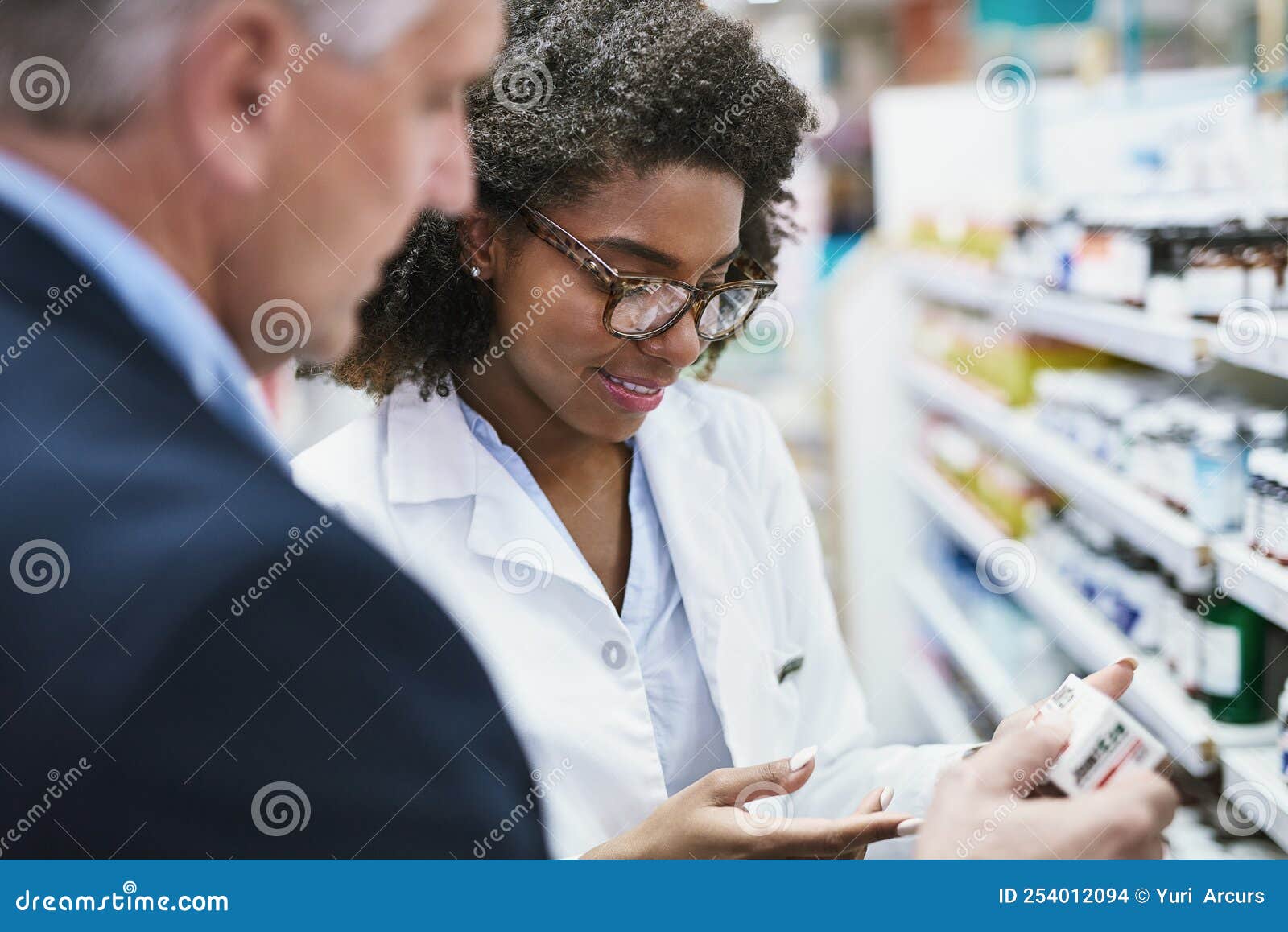 These Work Miracles. a Helpful Young Female Pharmacist Helping a ...