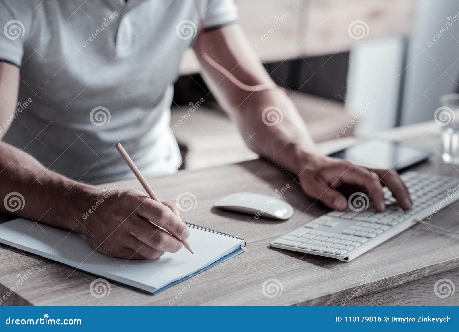 Close Up of Man Taking Notes while Working on Pc Stock Photo - Image of ...