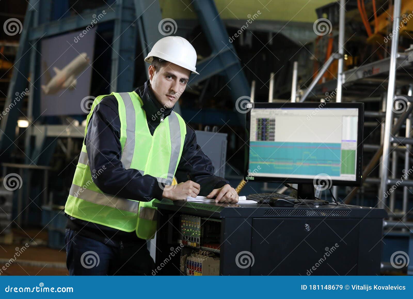 Portrait of a Man , Factory Engineer in Work Clothes Controlling the ...