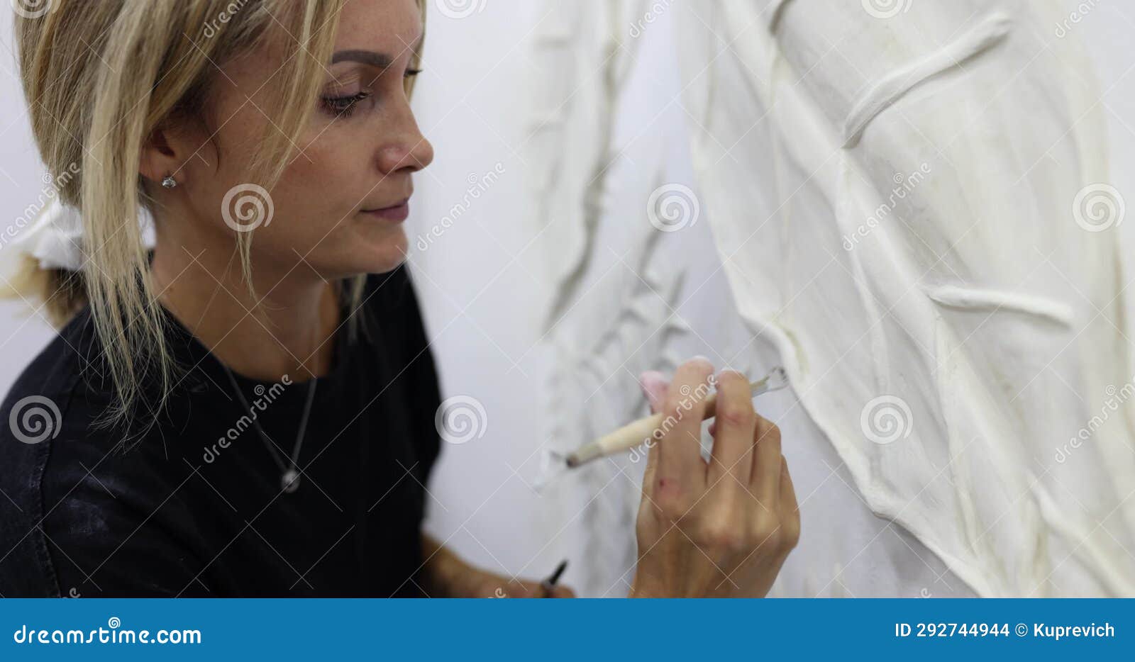 Work Process Worker Applies Putty Solution To Wall with Bas-relief ...