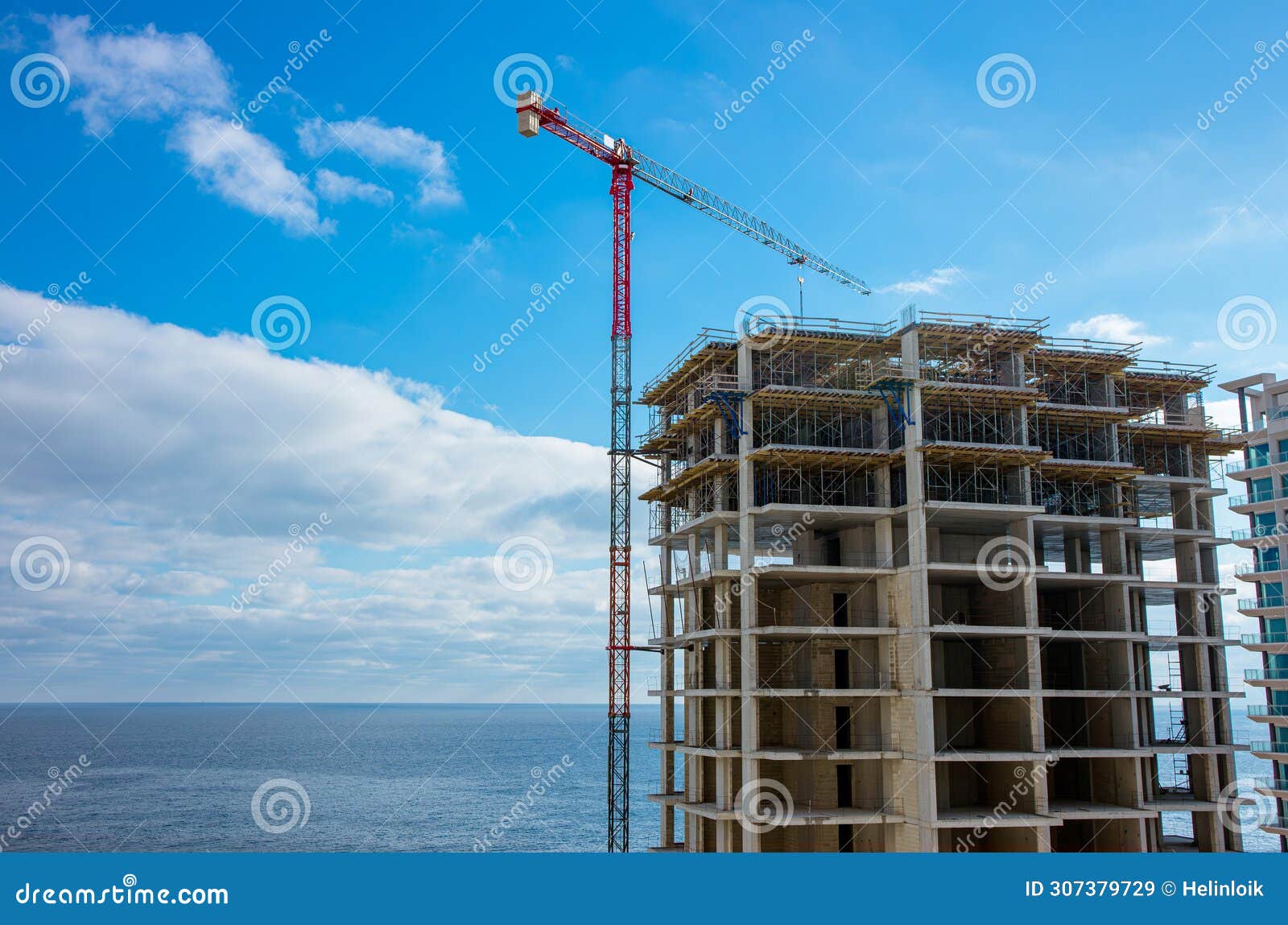 Work in Progress, Building Tall Luxury Tower Building by the Sea. Stock ...