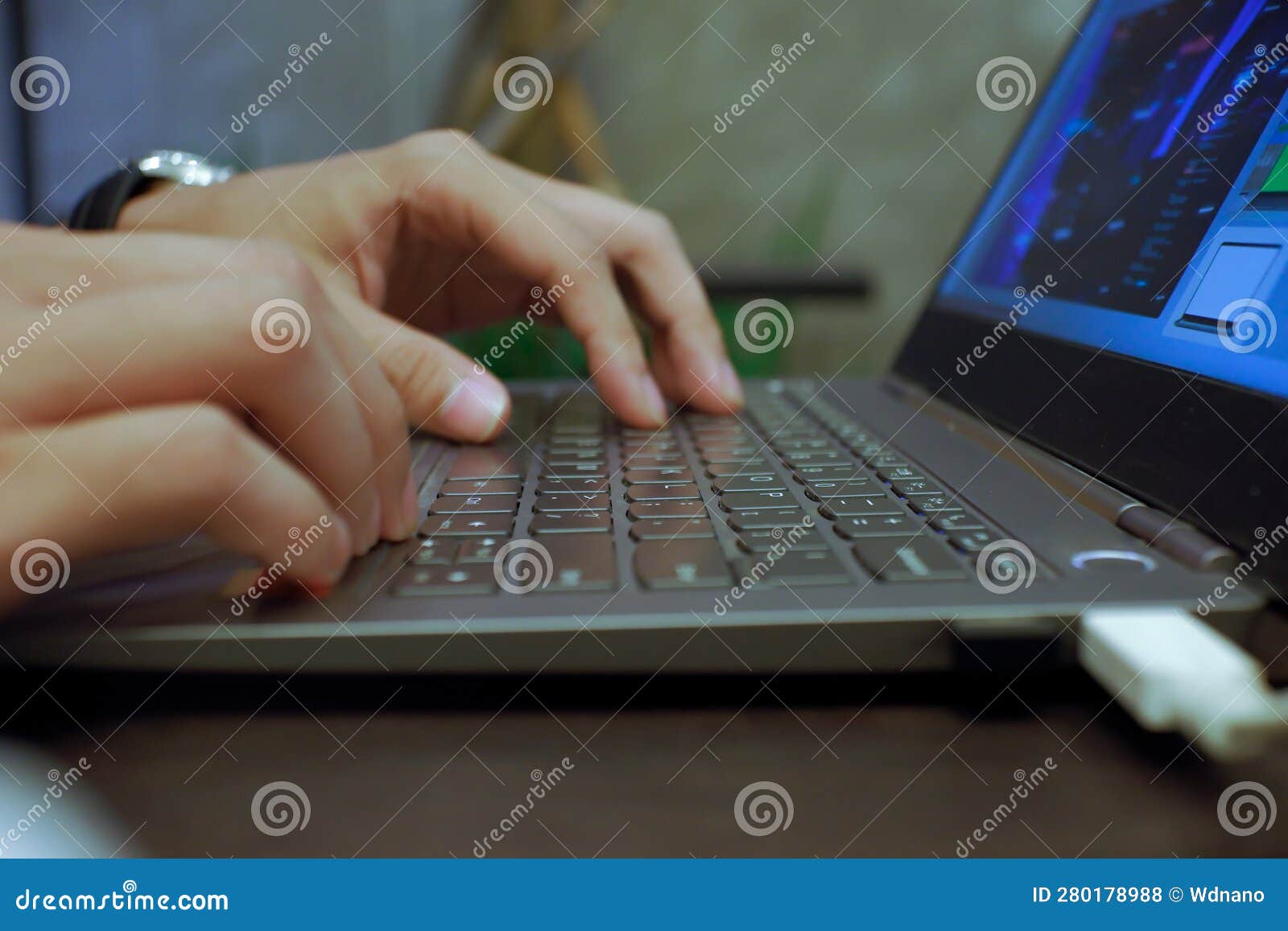 Productive Digital Workspace: Close-Up View of Hands Typing on a Laptop ...