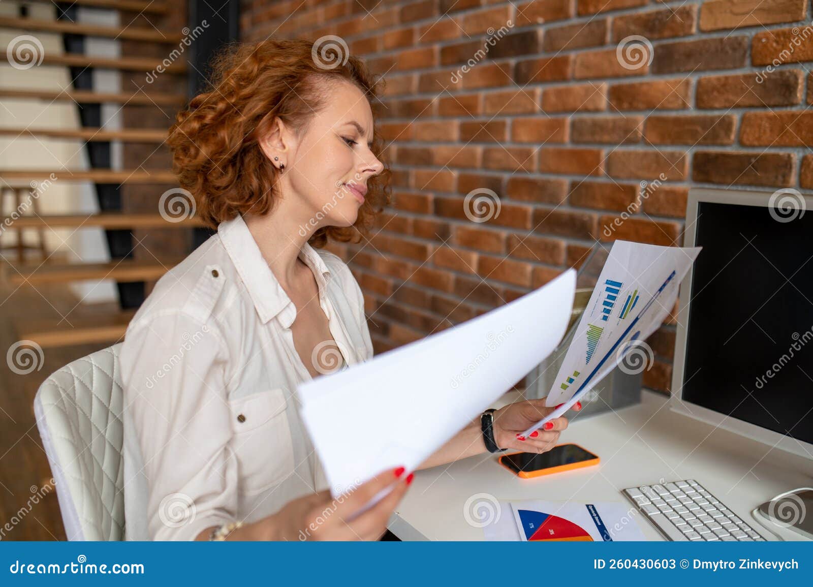 Female Manager Scrutinizing Papers and Looking Involved Stock Image ...