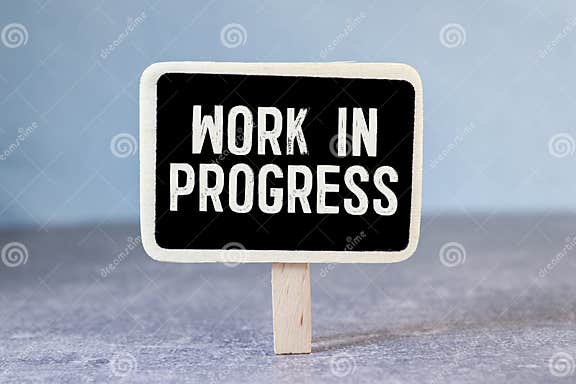 WORK in PROGRESS Text on Notebook with Chart and Calculator. Stock ...