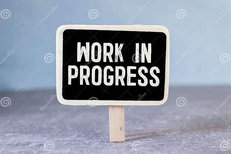 WORK in PROGRESS Text on Notebook with Chart and Calculator. Stock ...