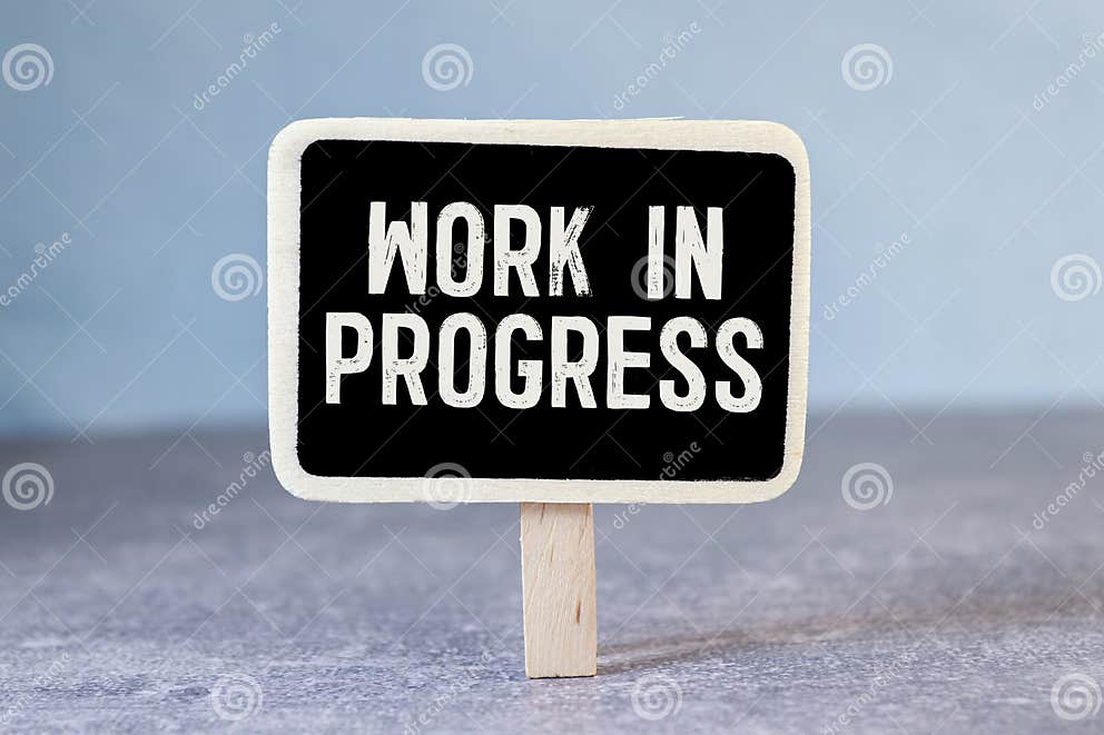 WORK in PROGRESS Text on Notebook with Chart and Calculator. Stock ...