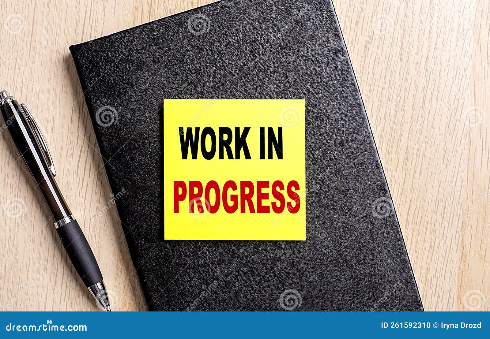 WORK in PROGRESS Text on a Sticky on Black Notebook with Pen Stock ...