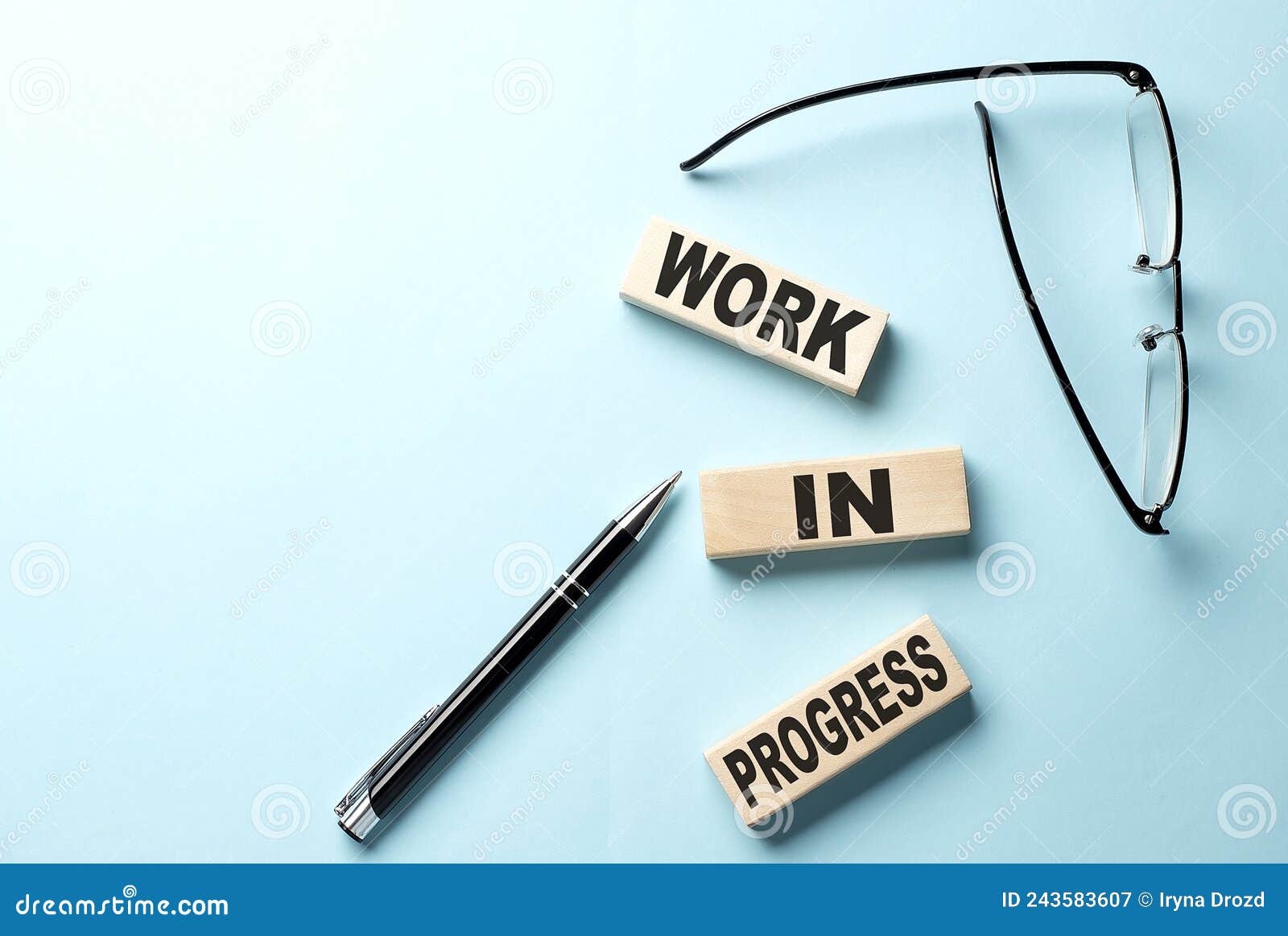 WORK in PROGRESS Text on a Wooden Block ,blue Background Stock Image ...