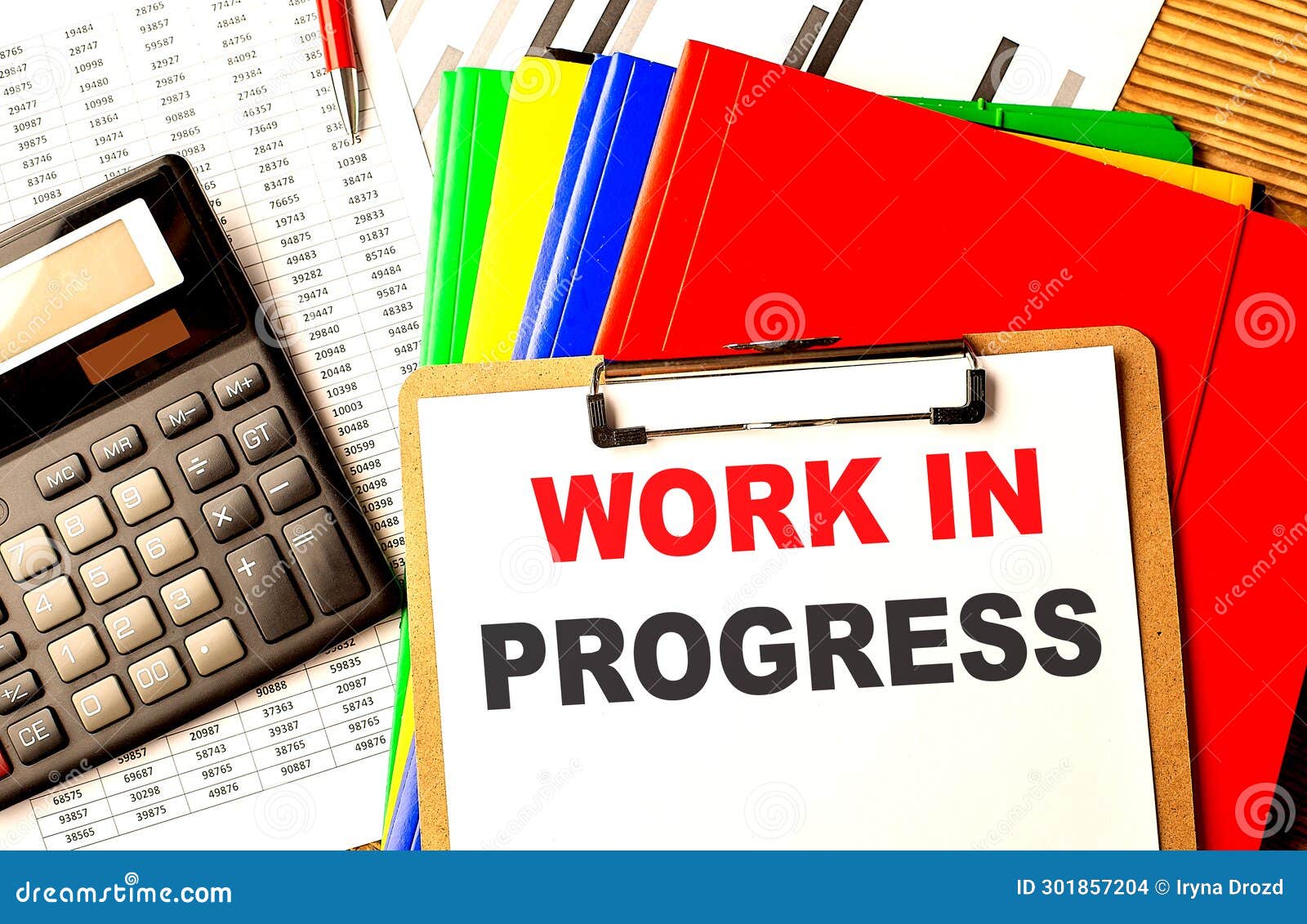 WORK in PROGRESS Text Written on Paper Clipboard with Chart and ...