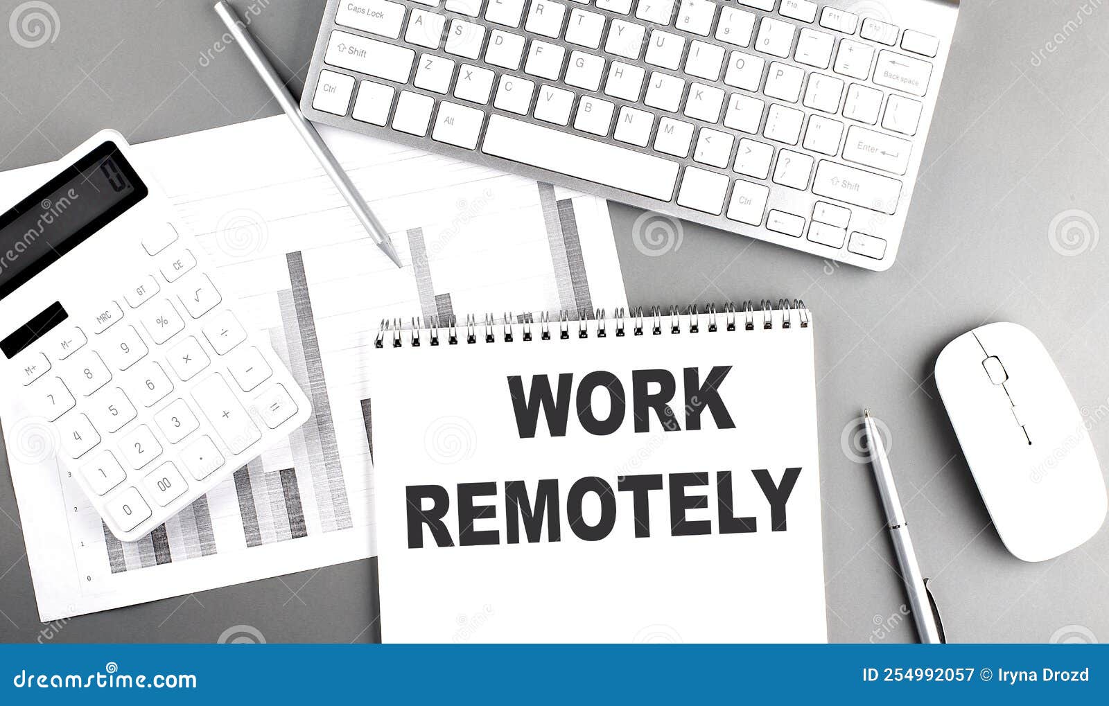 WORK REMOTELY Text Written on Notebook on Grey Background with Chart ...