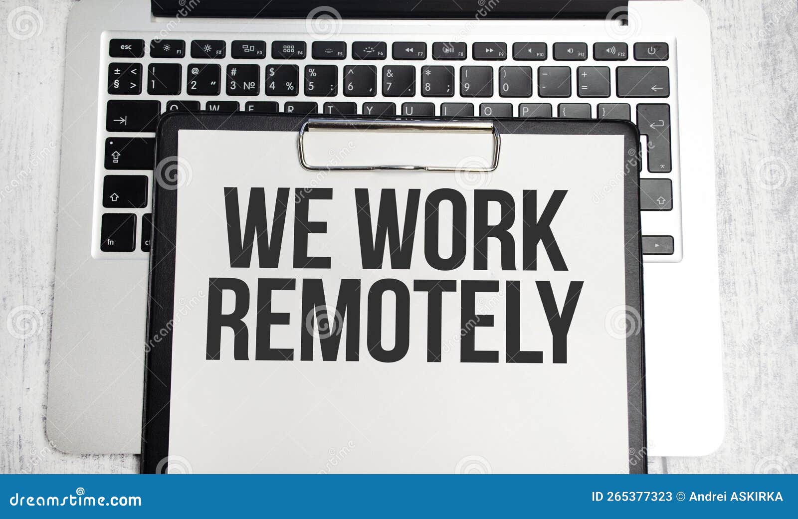 We Work Remotely Words on Paper Tablet on Laptop Stock Image - Image of ...