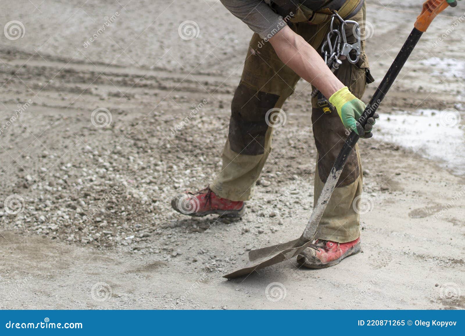 Work with a Shovel at a Construction Site. a Worker Throws Cement and ...