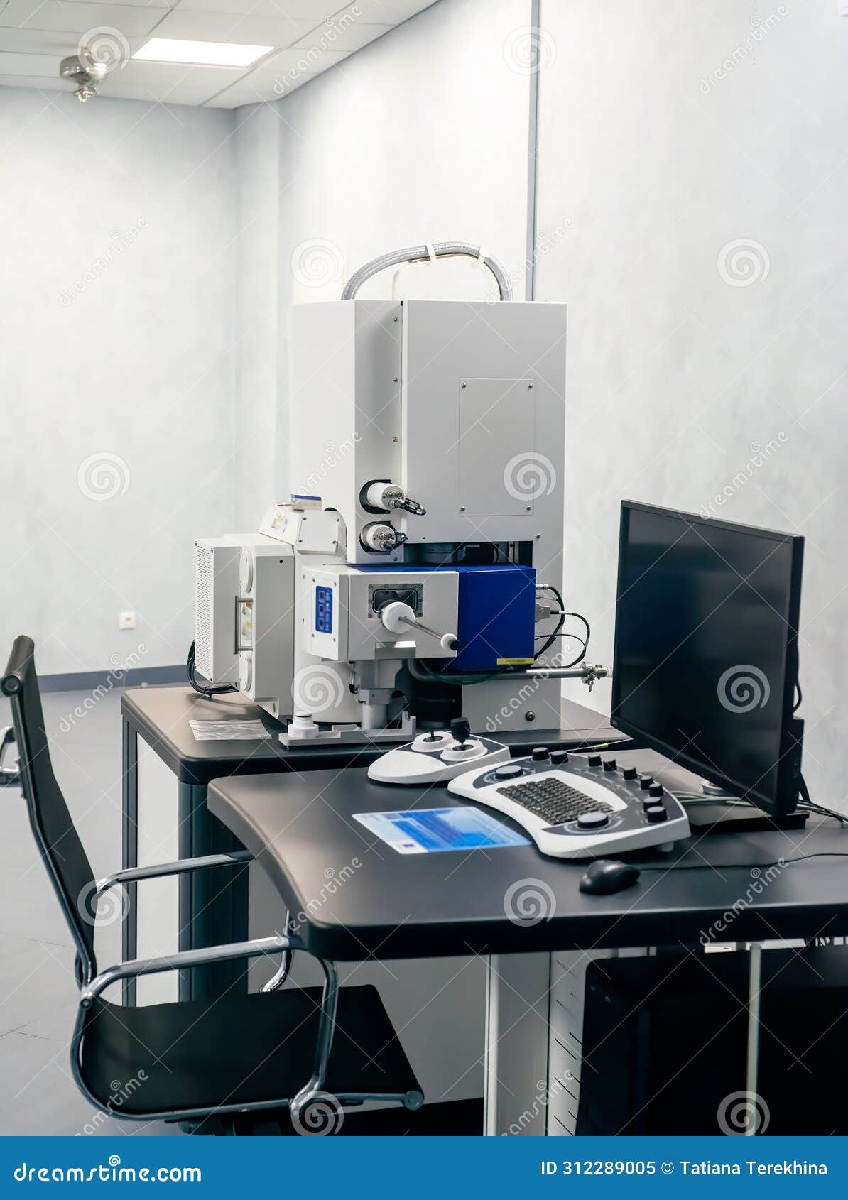 Work Space of a Scientist with Electron Microscope, Table and Computer ...