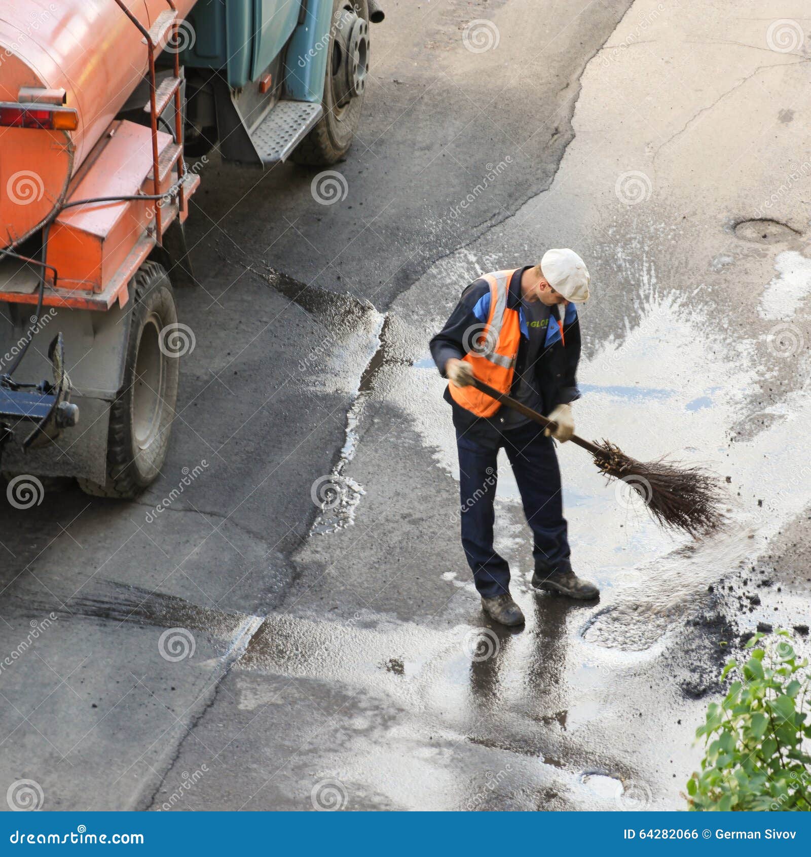 Work Sweeps Puddles on the Road. Editorial Photo - Image of road ...