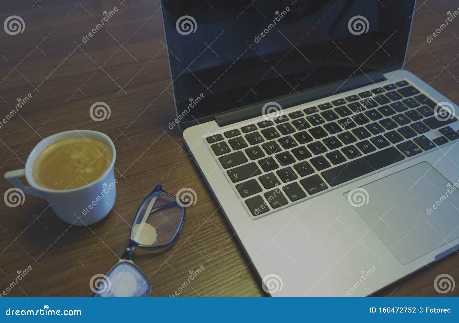 Work Table with Laptop, Coffee and a Glasses. Editorial Photography ...