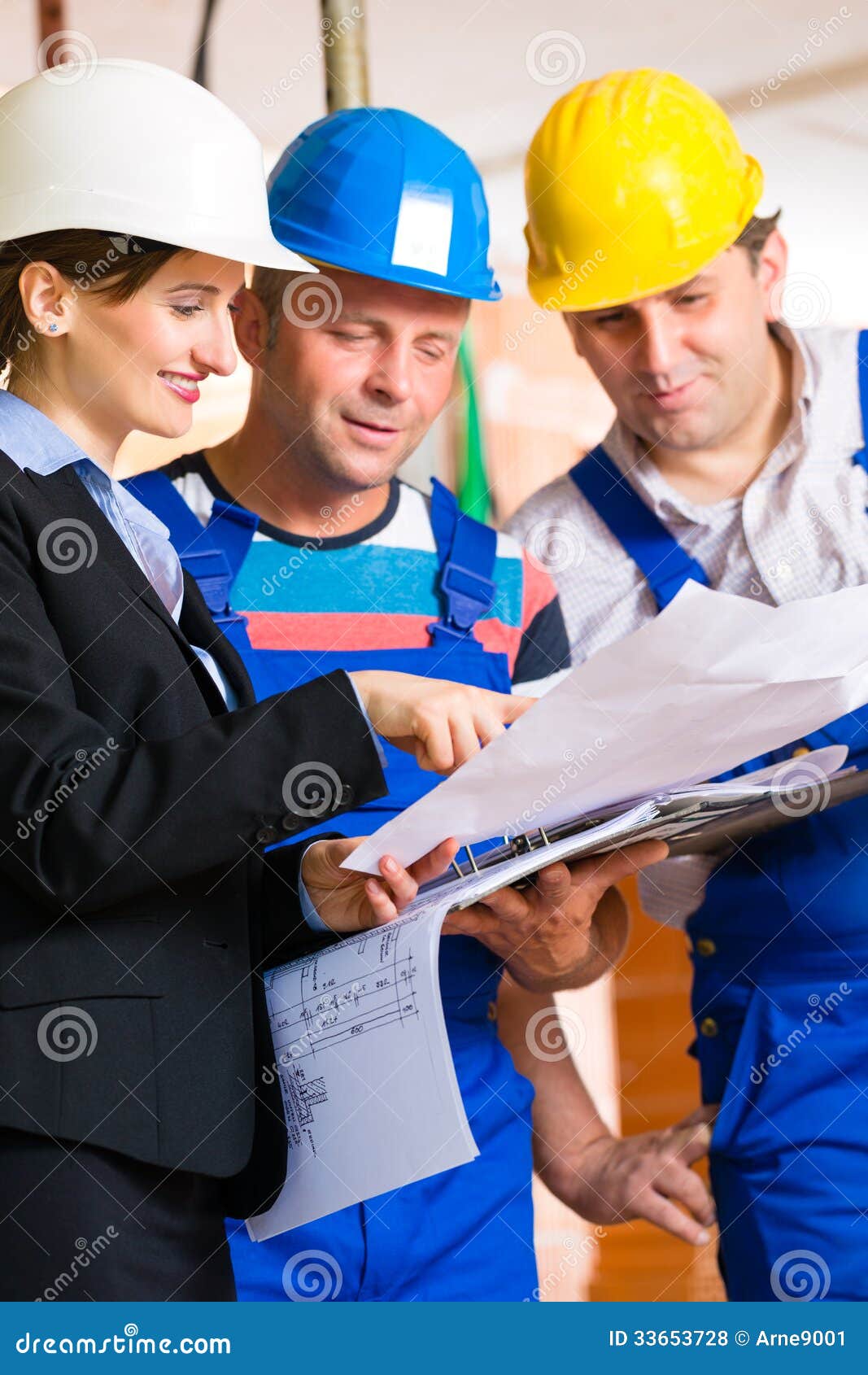 Work Team on Construction Site Controlling Floor Plan Stock Photo ...