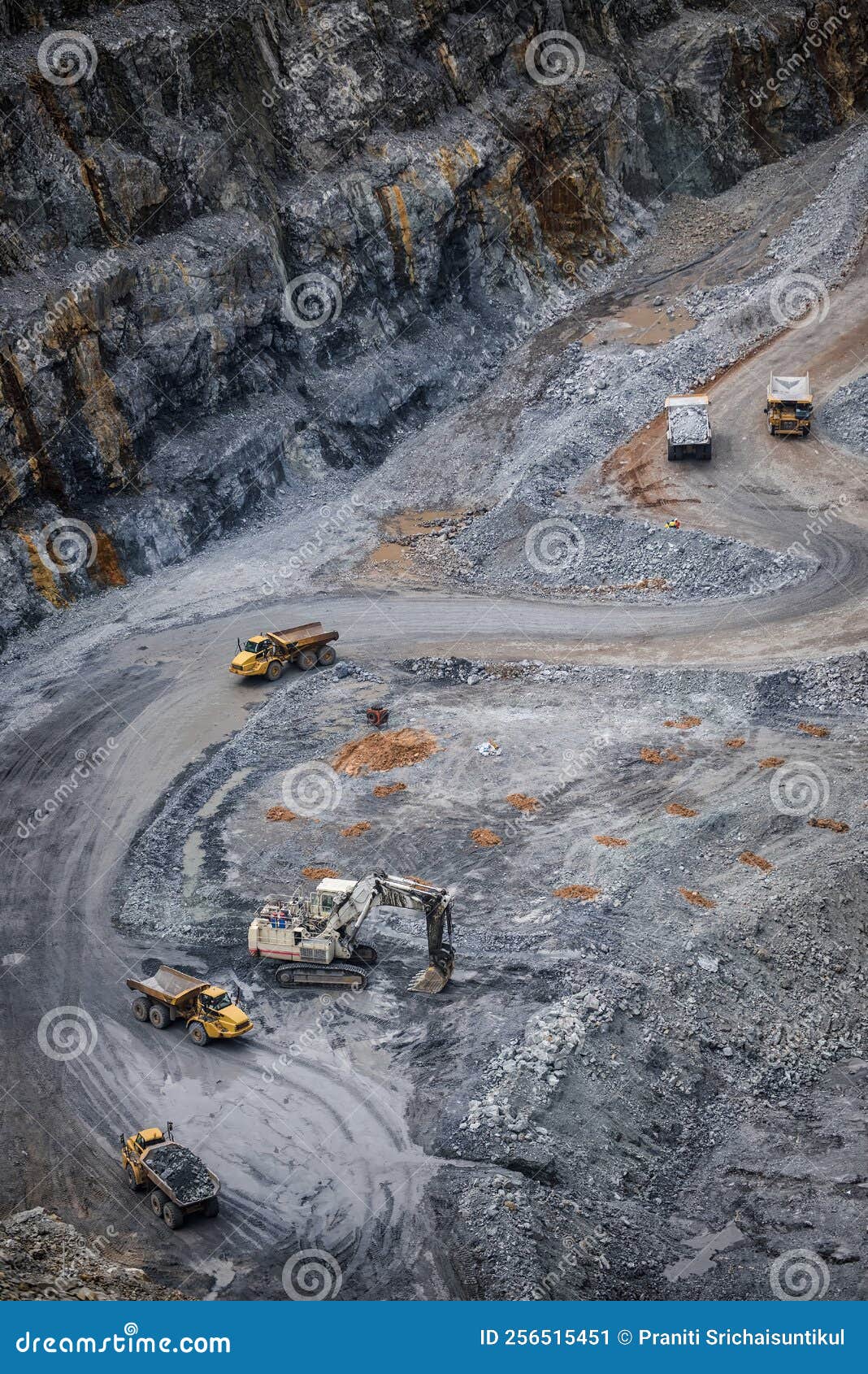 Work of Trucks and the Excavator in an Open Pit on Gold Mining Stock ...