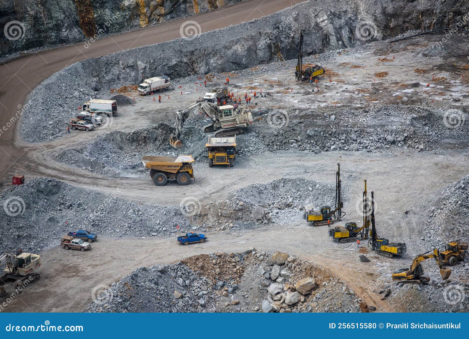 Work of Trucks and the Excavator in an Open Pit on Gold Mining Stock ...