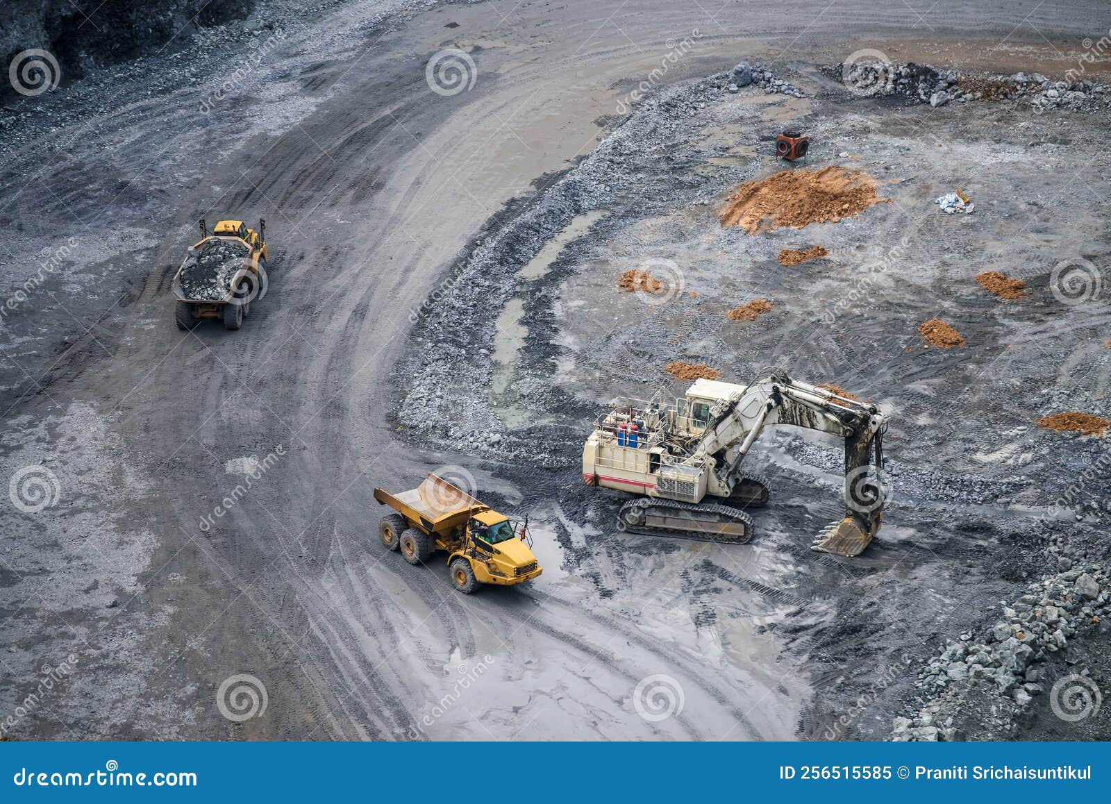 Work of Trucks and the Excavator in an Open Pit on Gold Mining Stock ...