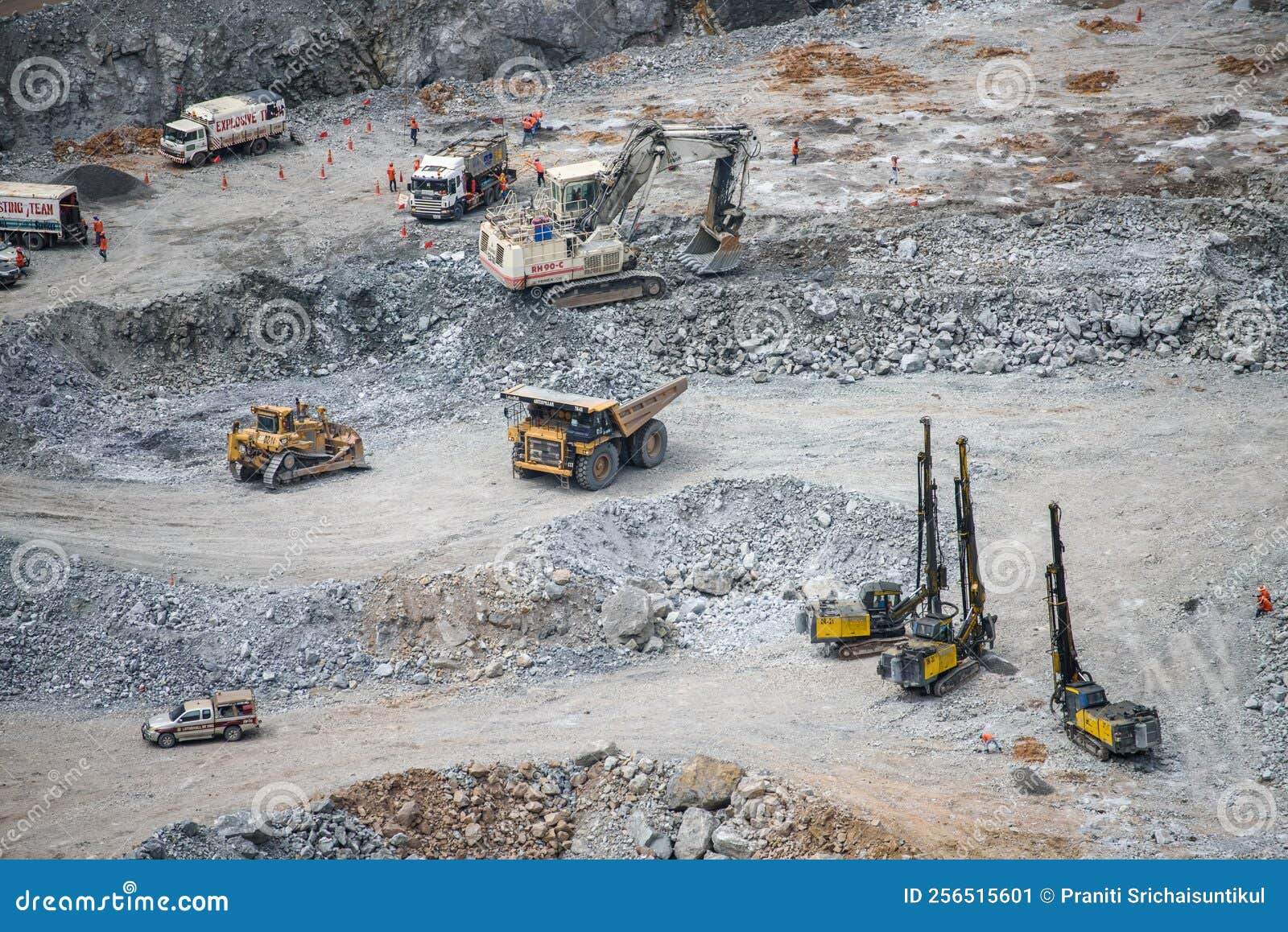 Work of Trucks and the Excavator in an Open Pit on Gold Mining Stock ...