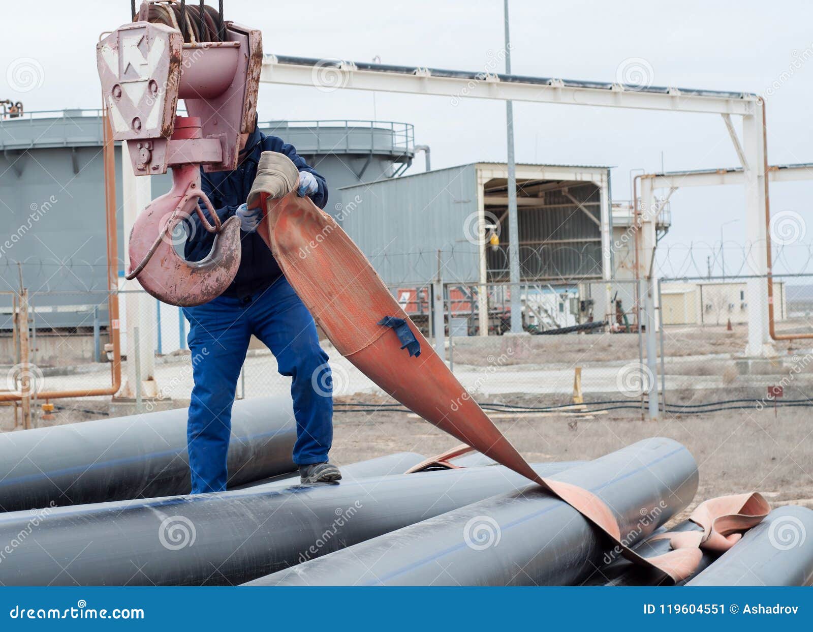 Work on Unloading of Pipes for Construction. Stock Image - Image of ...