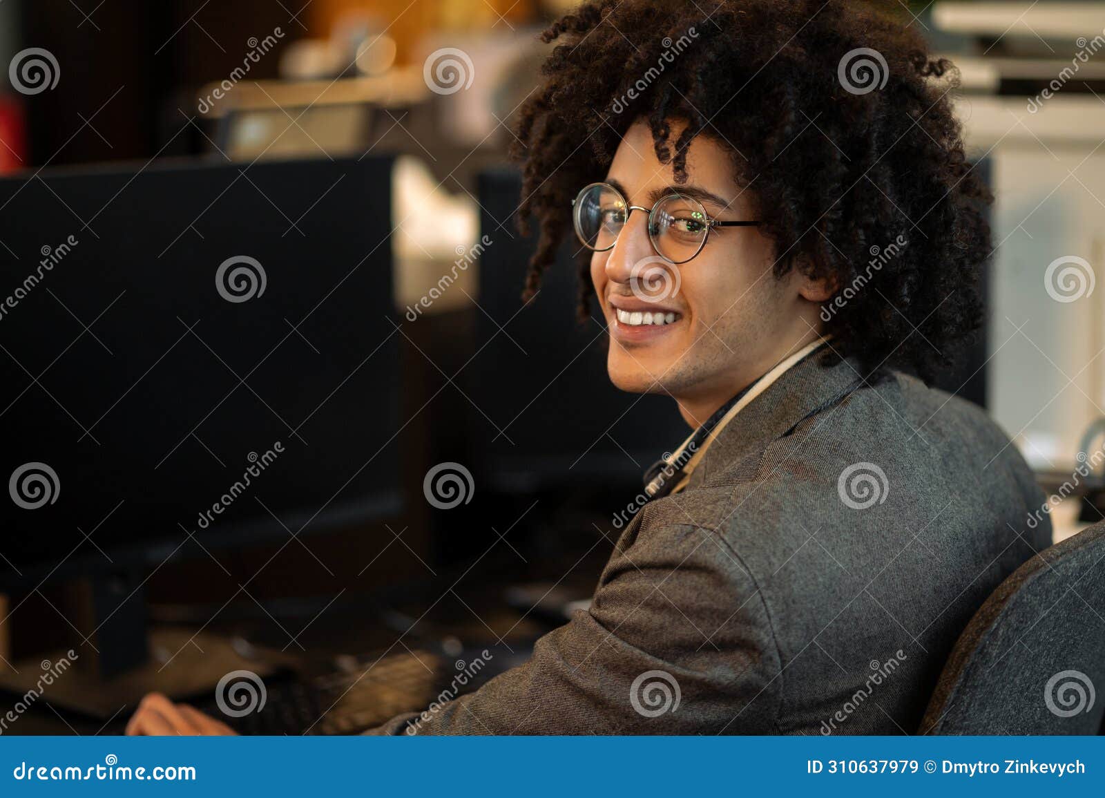 Waist Up of a Curly-haired Young Man Sitting at Computer Stock Image ...