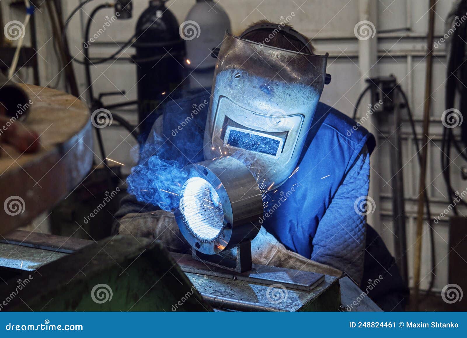 Work of a Welder, in a Chrome Welding Helmet, Blue Glow Stock Image ...