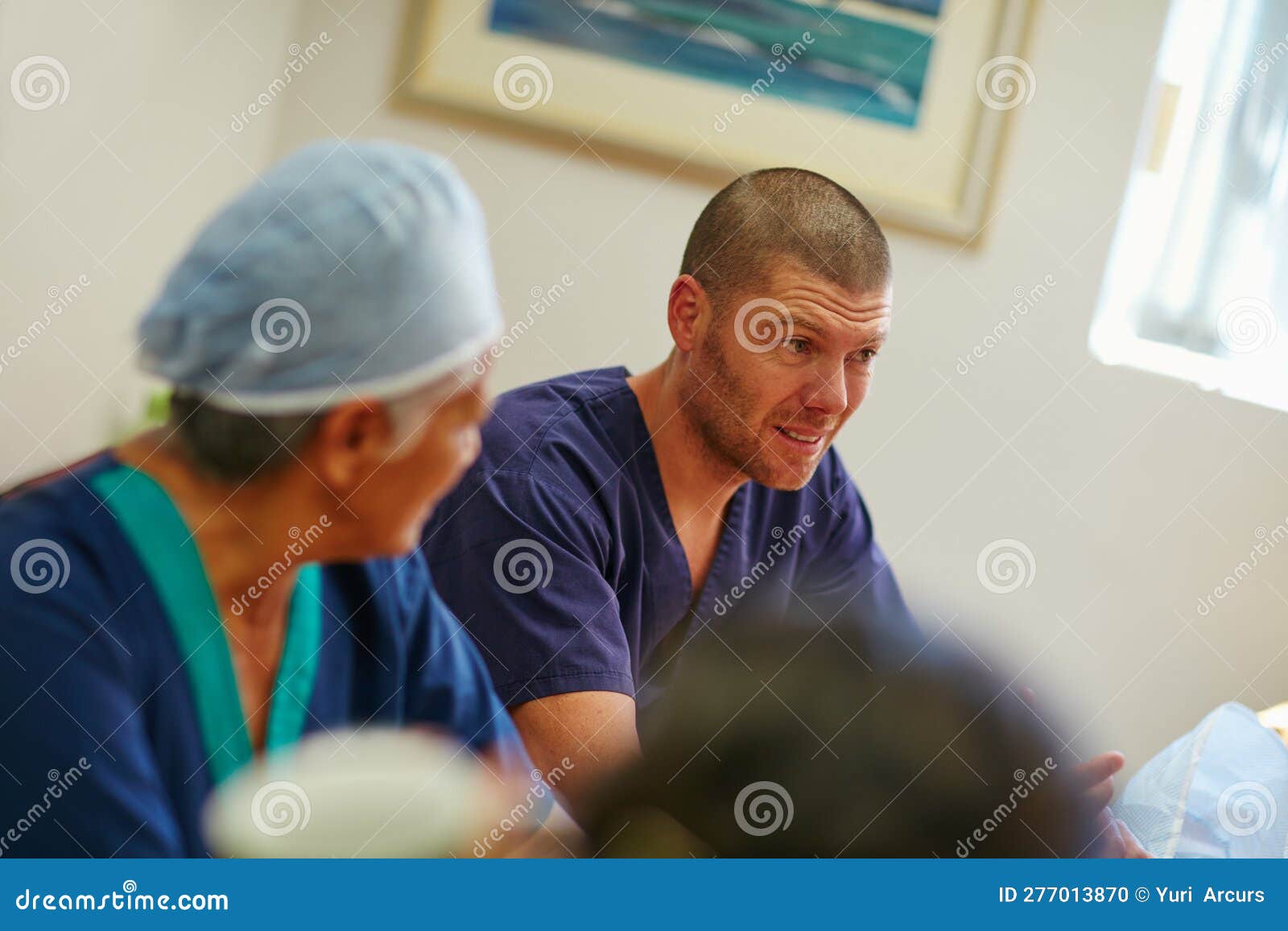They Work Well Together. Medical Practitioners Having a Chat while on ...