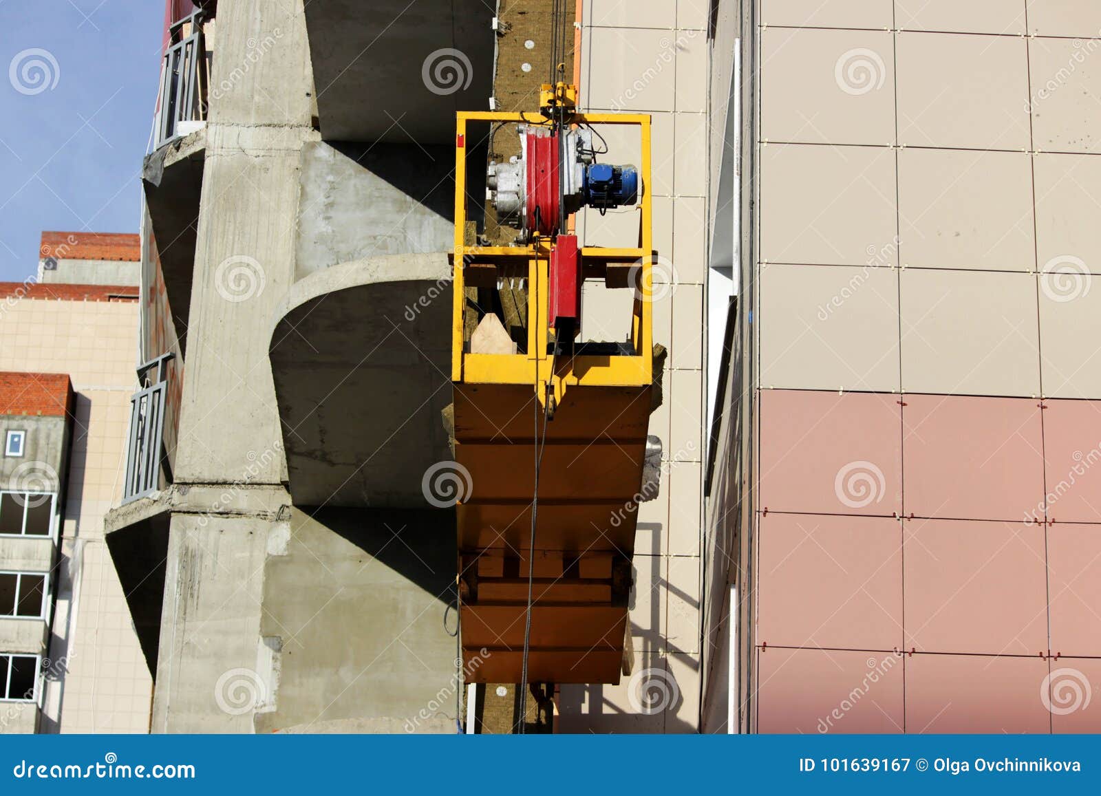 Suspended Cradle On The Facade Of The Skyscraper. Mobile Scaffolding ...