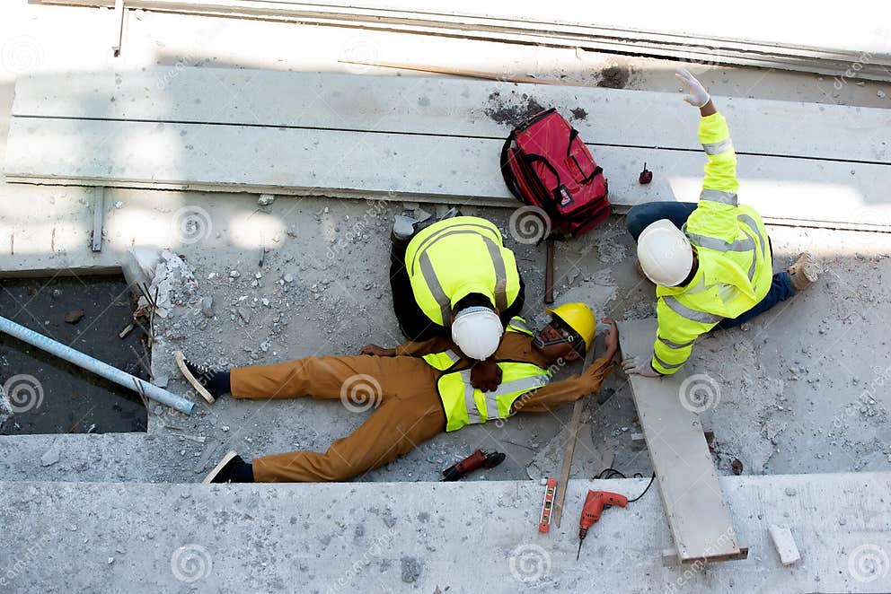 Worker Accident at Work in Construction Job Near Construct Building. First Aid, Start ...