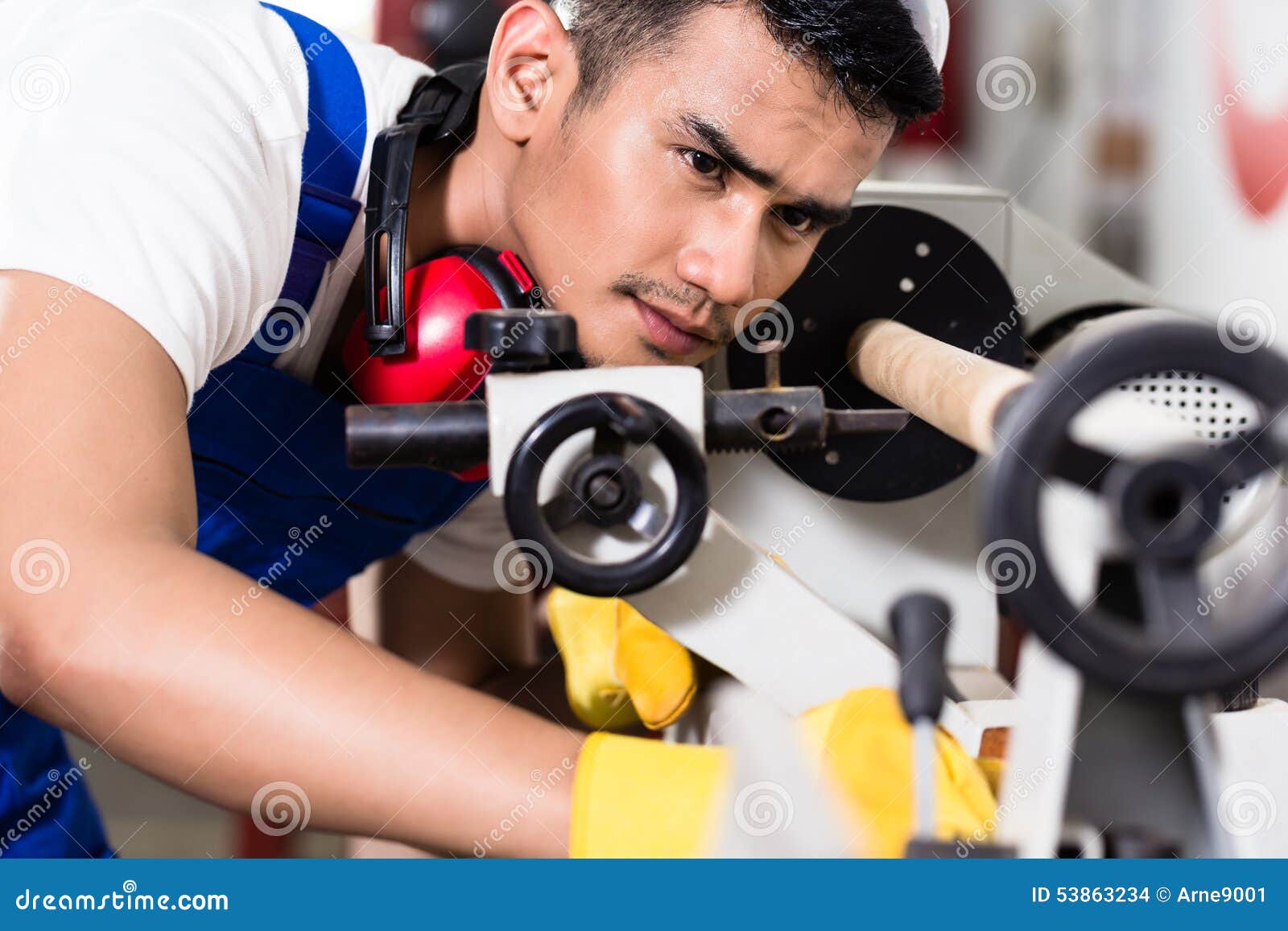 Worker Adjusting Turning Machine in Factory Stock Photo - Image of ...