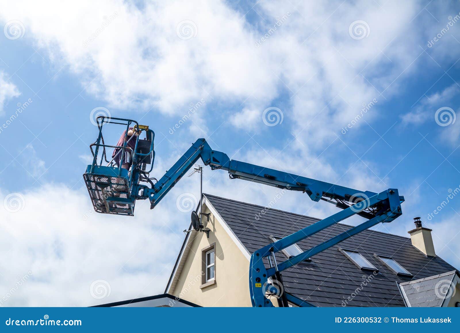 Worker on a Aerial Access Platform, Cherry Picker, Cleaning House Stock ...