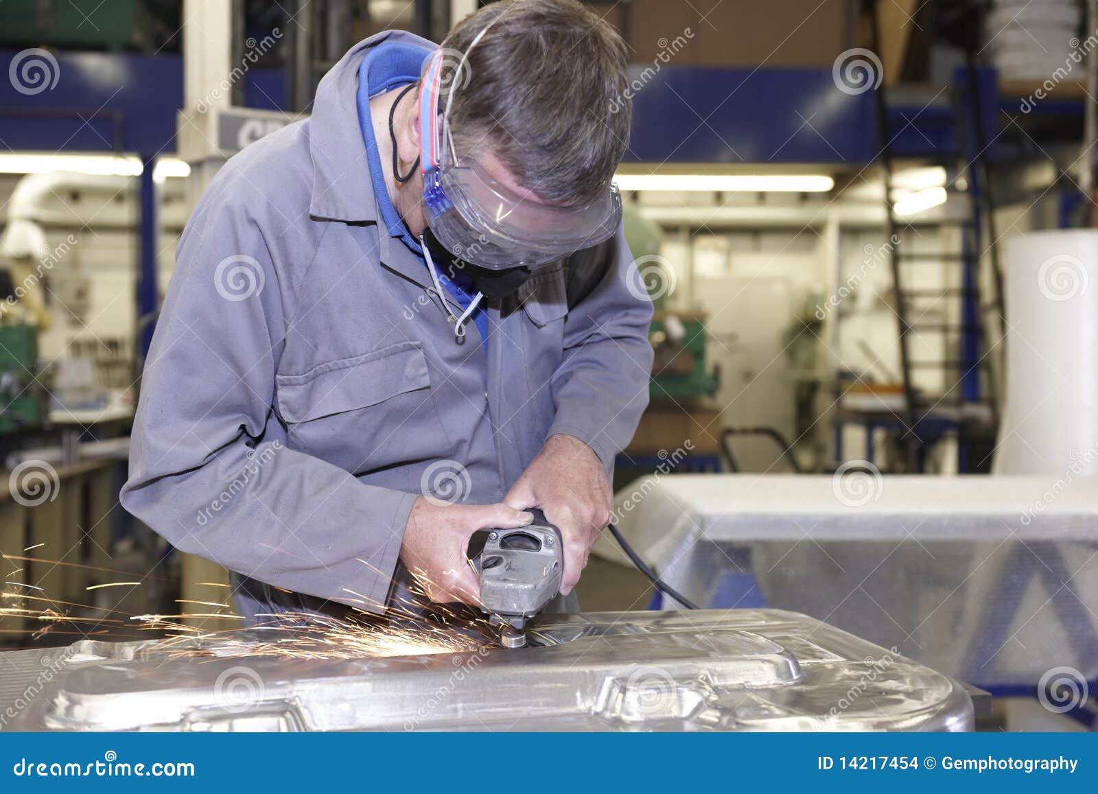 Worker with angle grinder stock photo. Image of workshop - 14217454