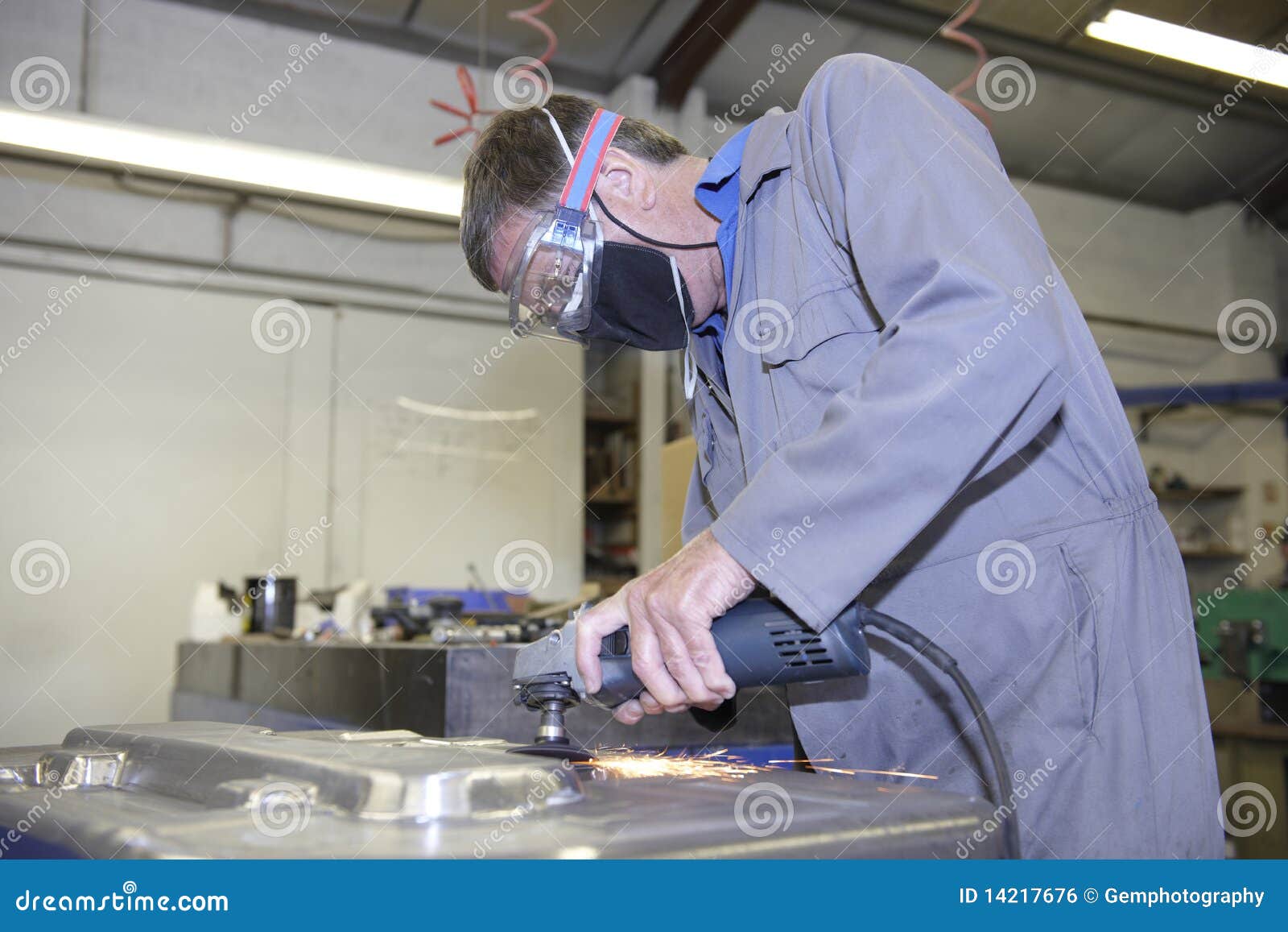 Worker with angle grinder stock photo. Image of craftsman - 14217676