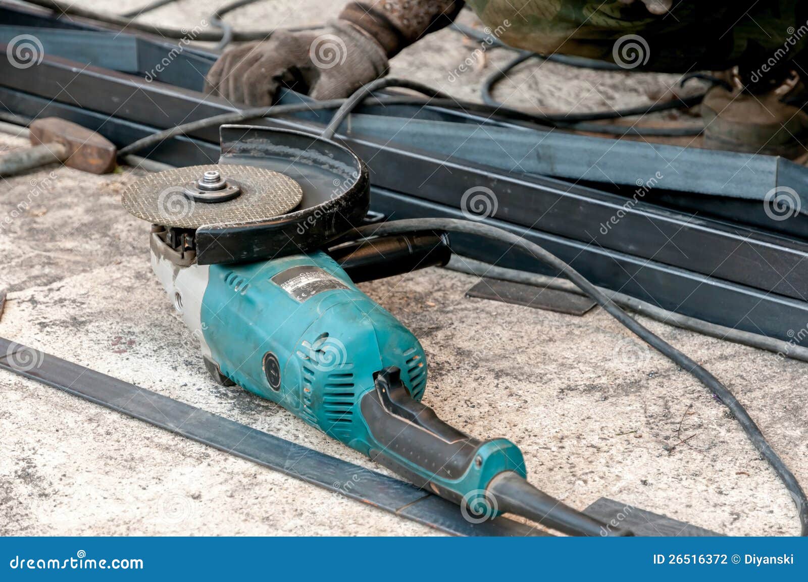 Worker with angle grinder stock photo. Image of metalworker - 26516372
