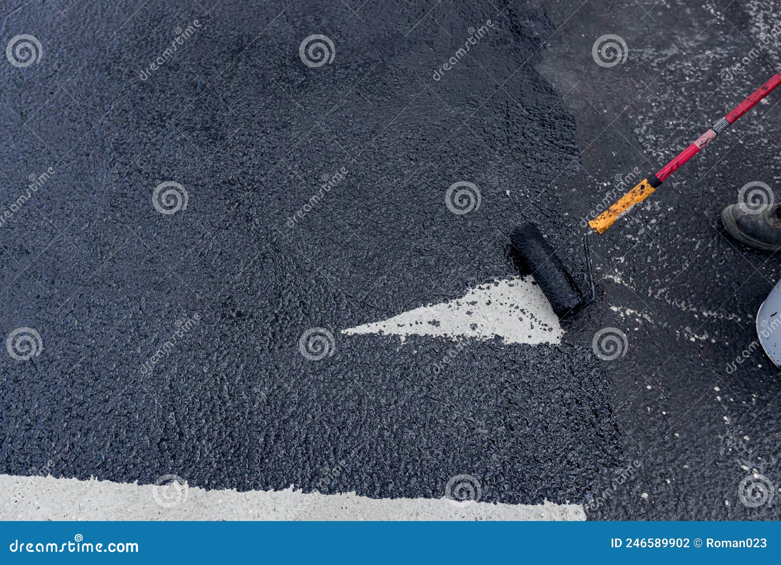 Worker Applies One Phase of Waterproofing with a Roller, the First ...