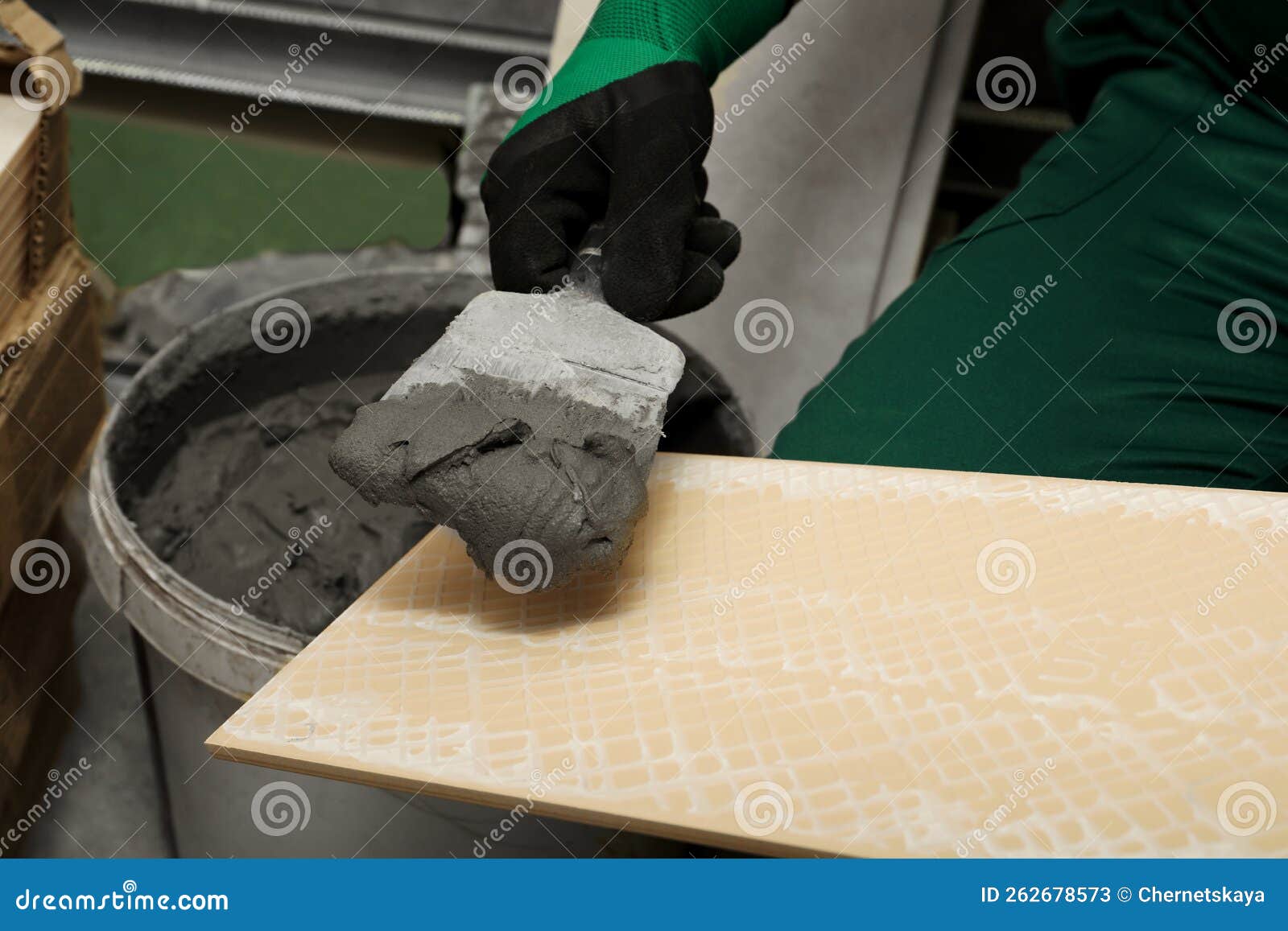 Worker Applying Adhesive Mix on Ceramic Tile with Spatula, Closeup ...