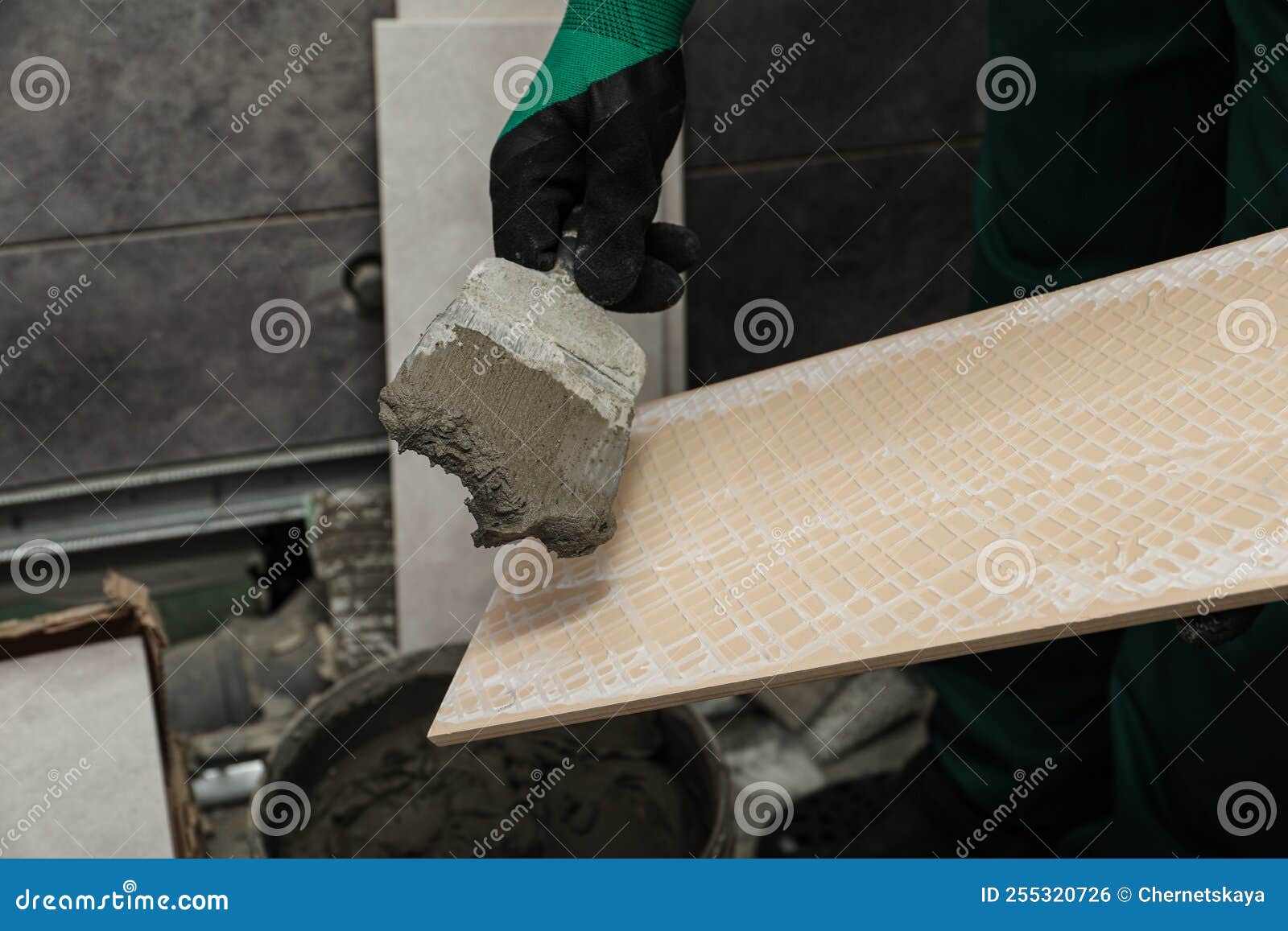 Worker Applying Adhesive Mix on Ceramic Tile with Spatula, Closeup ...