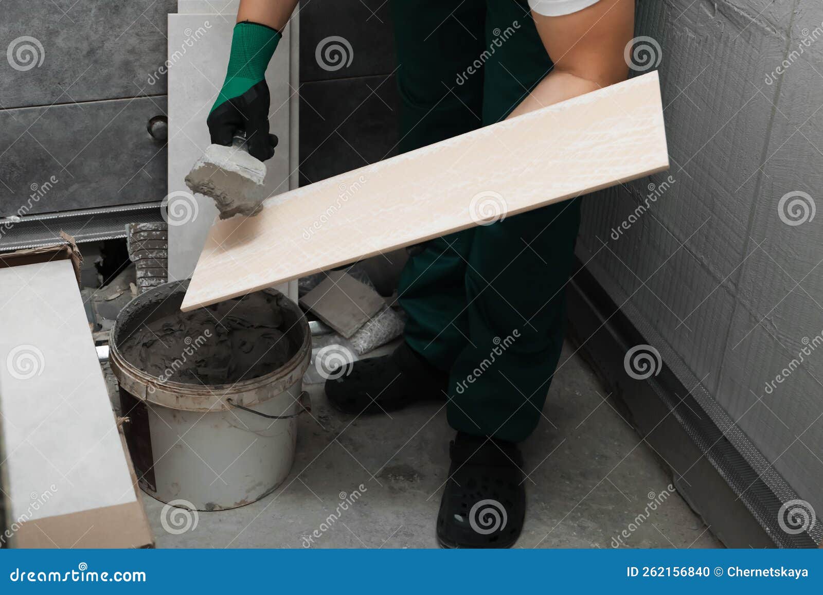 Worker Applying Adhesive Mix on Ceramic Tile with Spatula, Closeup ...