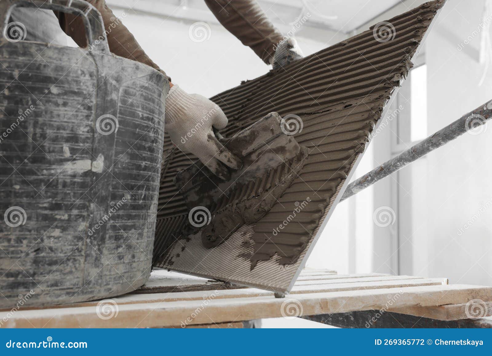 Worker Applying Cement on Tile for Installation in Room, Closeup Stock ...
