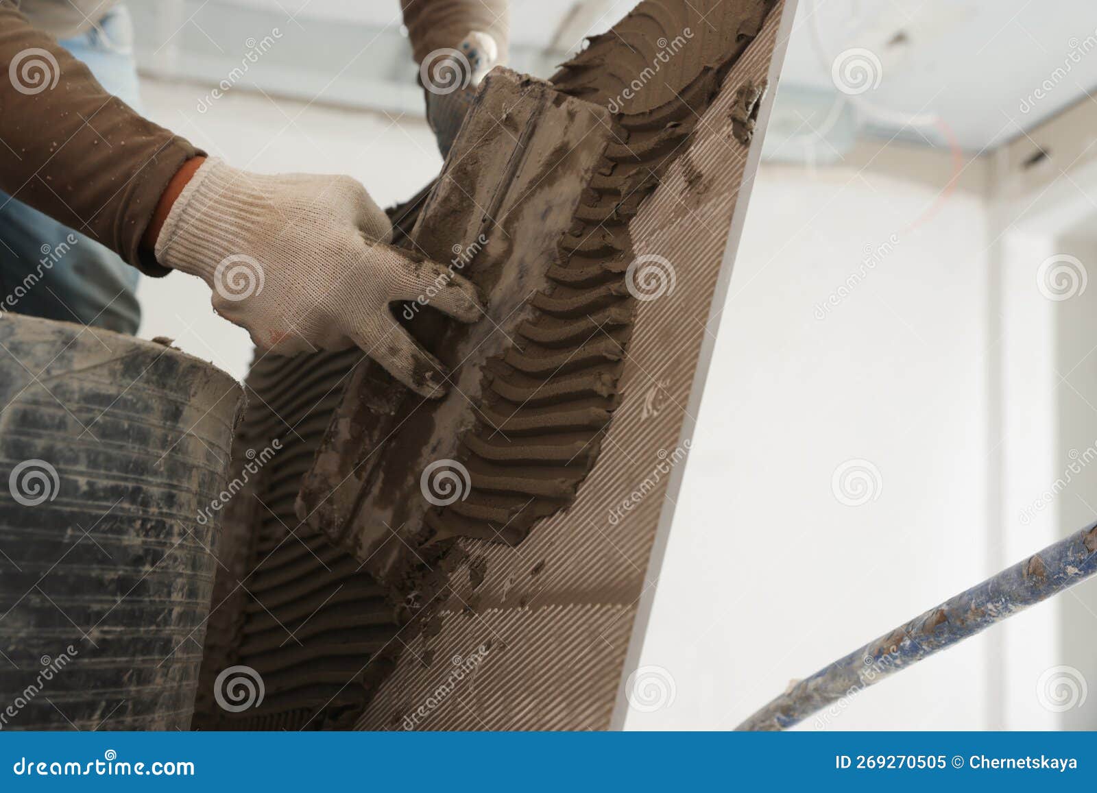 Worker Applying Cement on Tile for Installation in Room, Closeup Stock ...